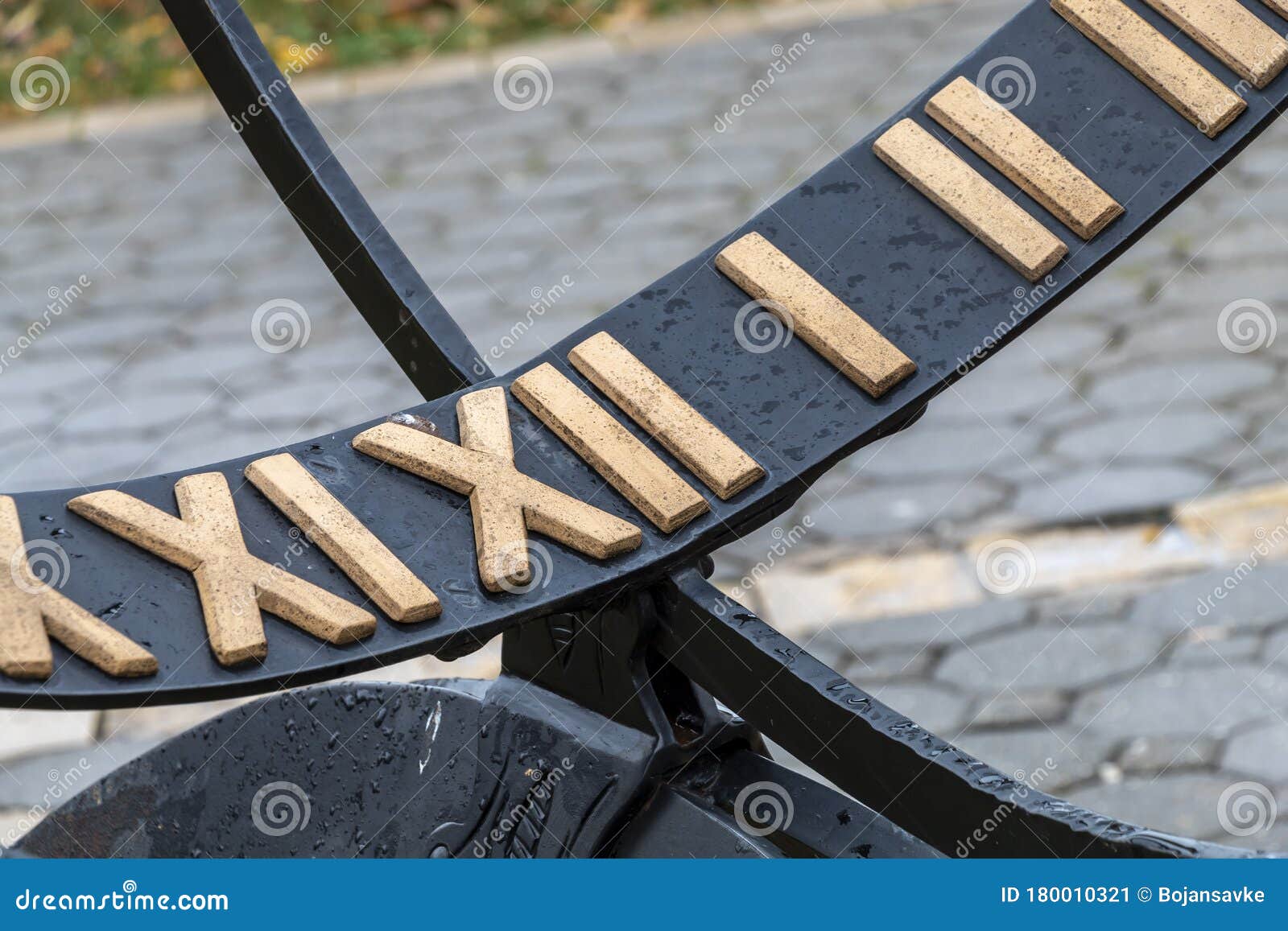 Close Up Black Metal Sun Clock with Roman Numerals Stock Image - Image ...