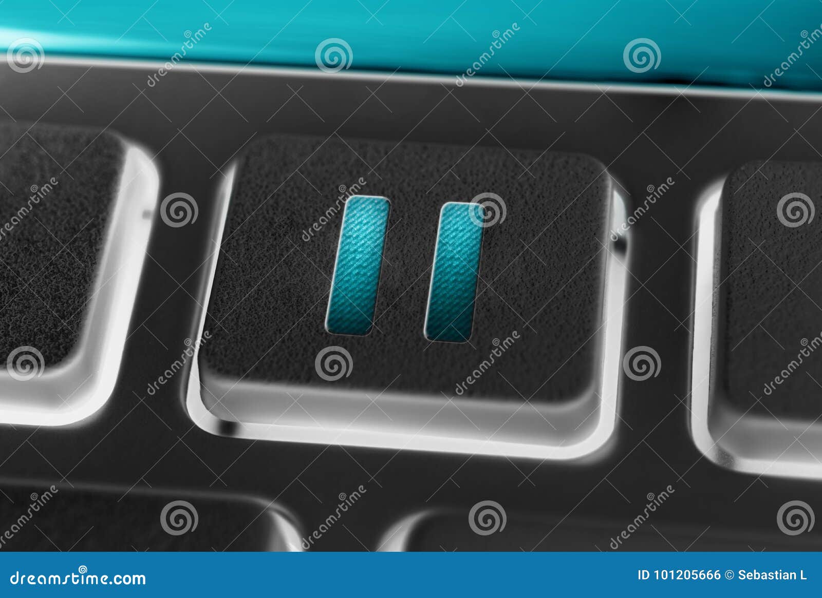 Close Up of a Black Pause Button of a Black Remote Control with ...