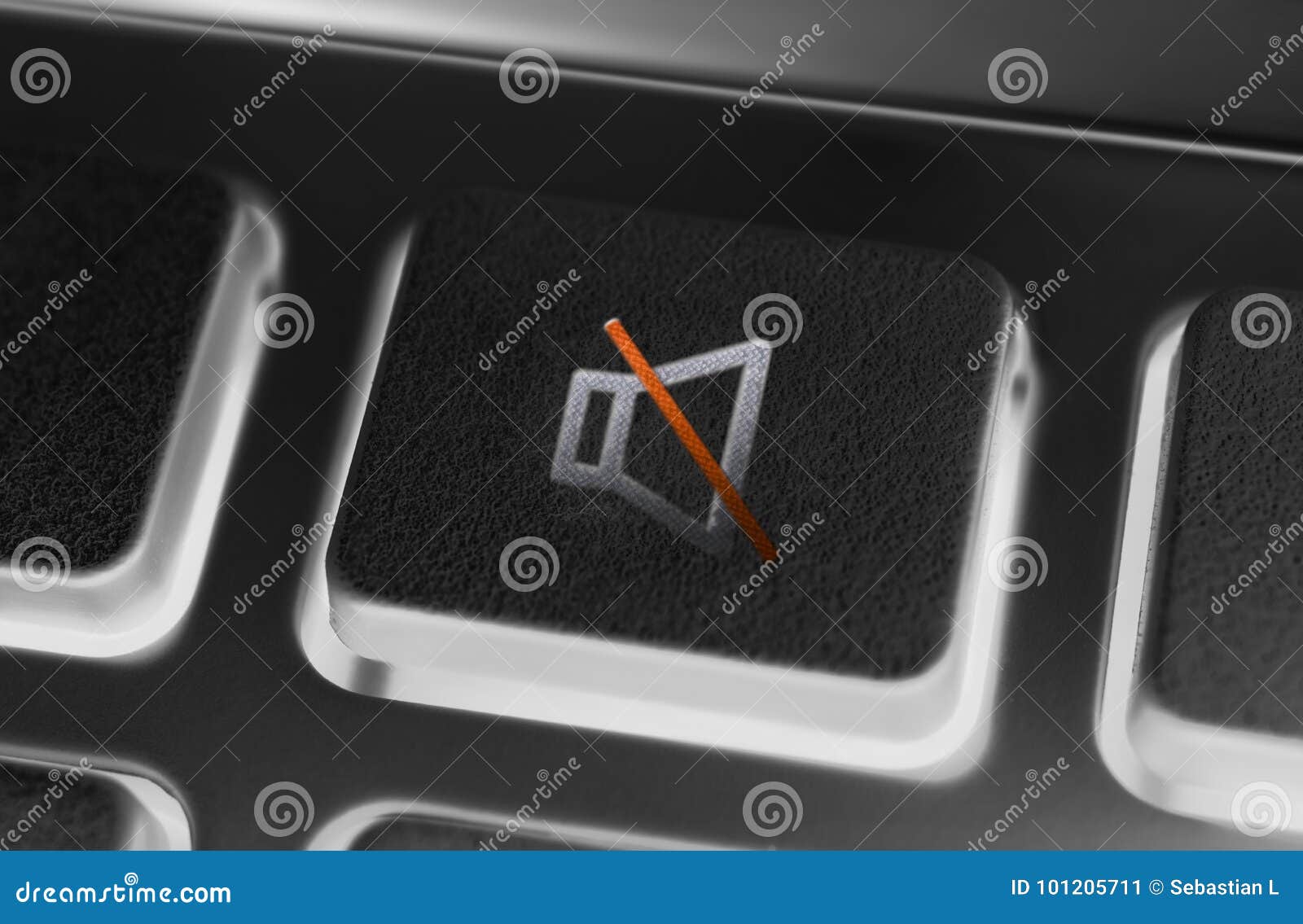 Close Up of a Black Volume Mute Button of a Black Remote Control with ...