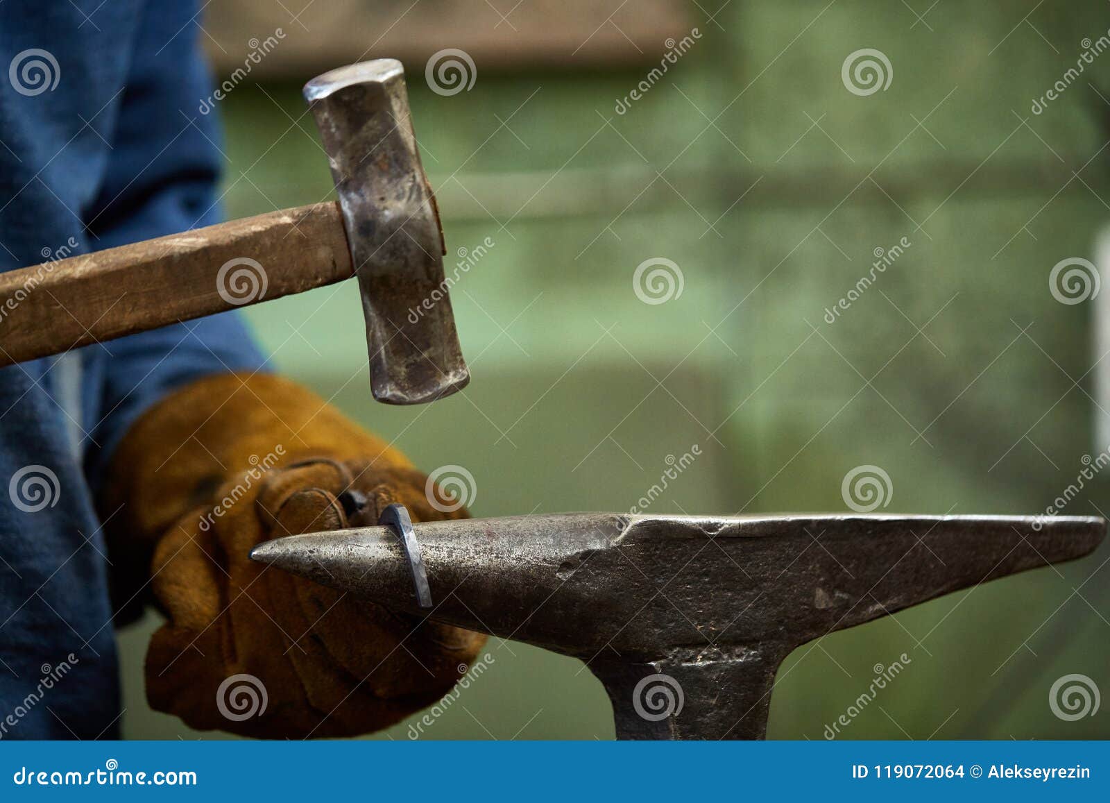 Close-up of a Blacksmith`s Hands Manipulating a Metal Piece Above His ...