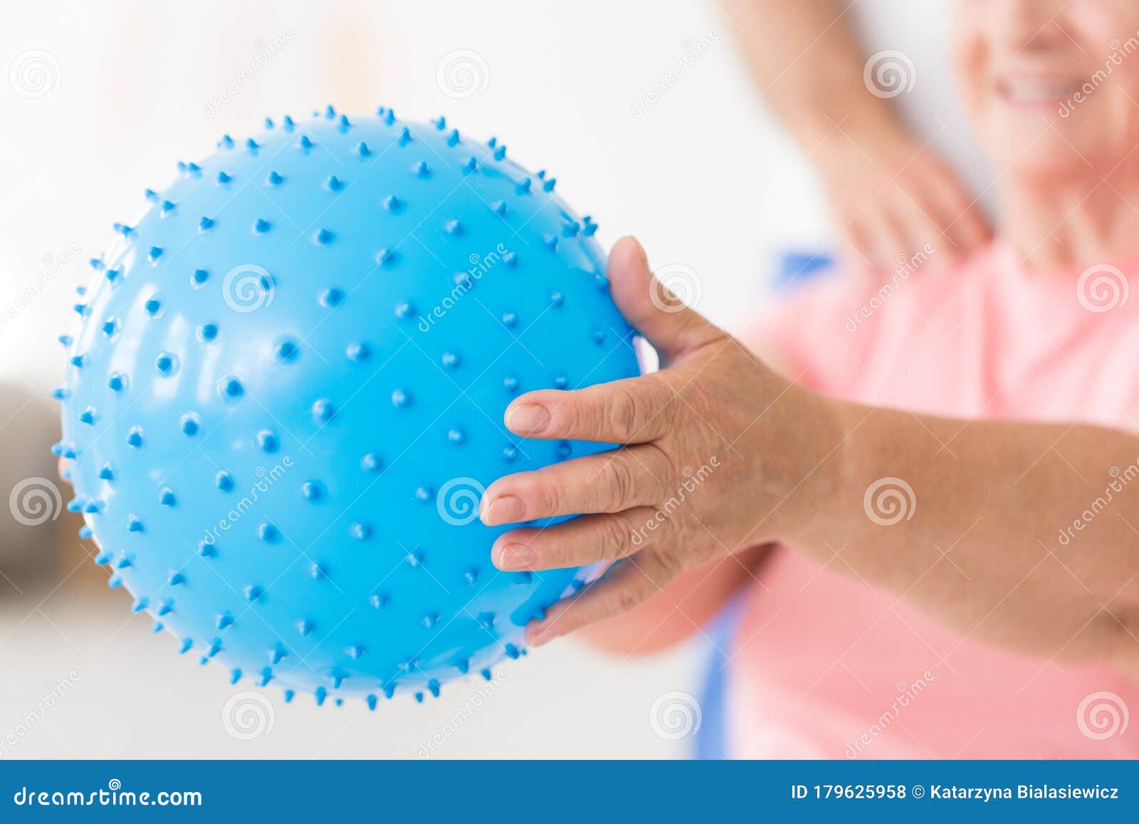 Blue, Bumpy Exercise Ball Held by a Senior Woman Stock Photo - Image of ...
