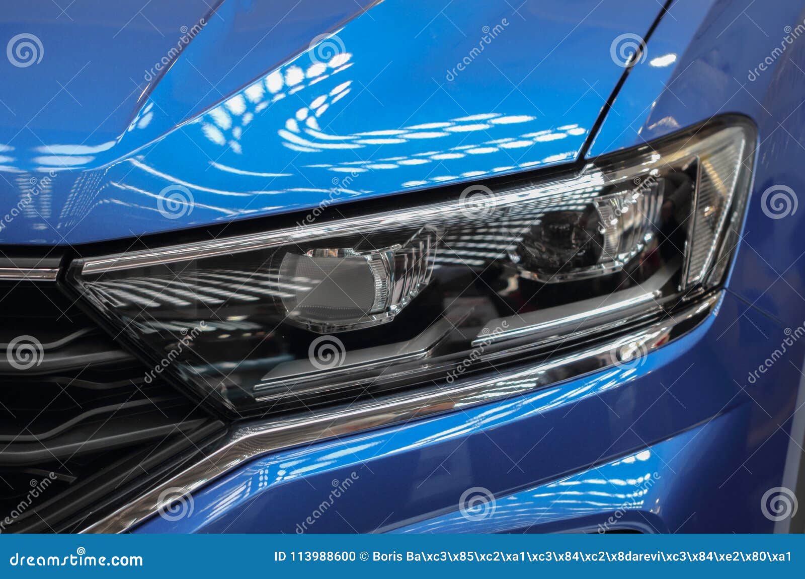 The Close Up of Blue Car Left Headlight. Stock Photo - Image of ...