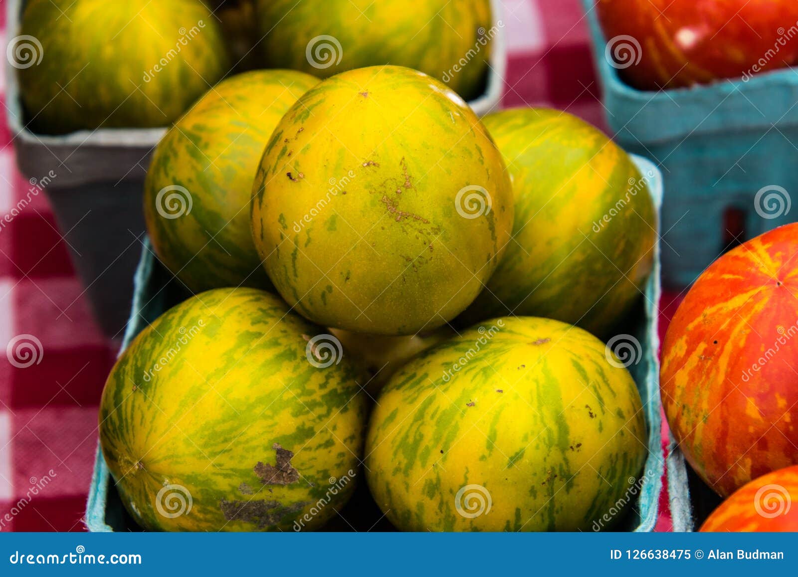 Close-up of Blue Quart Containers of Large Red and Green Tomatoes on a ...