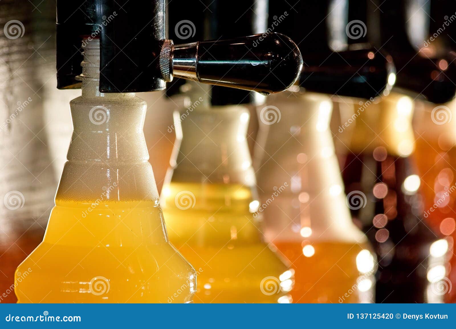 Close Up Bottle Filling with Light Beer. Stock Photo - Image of closeup ...