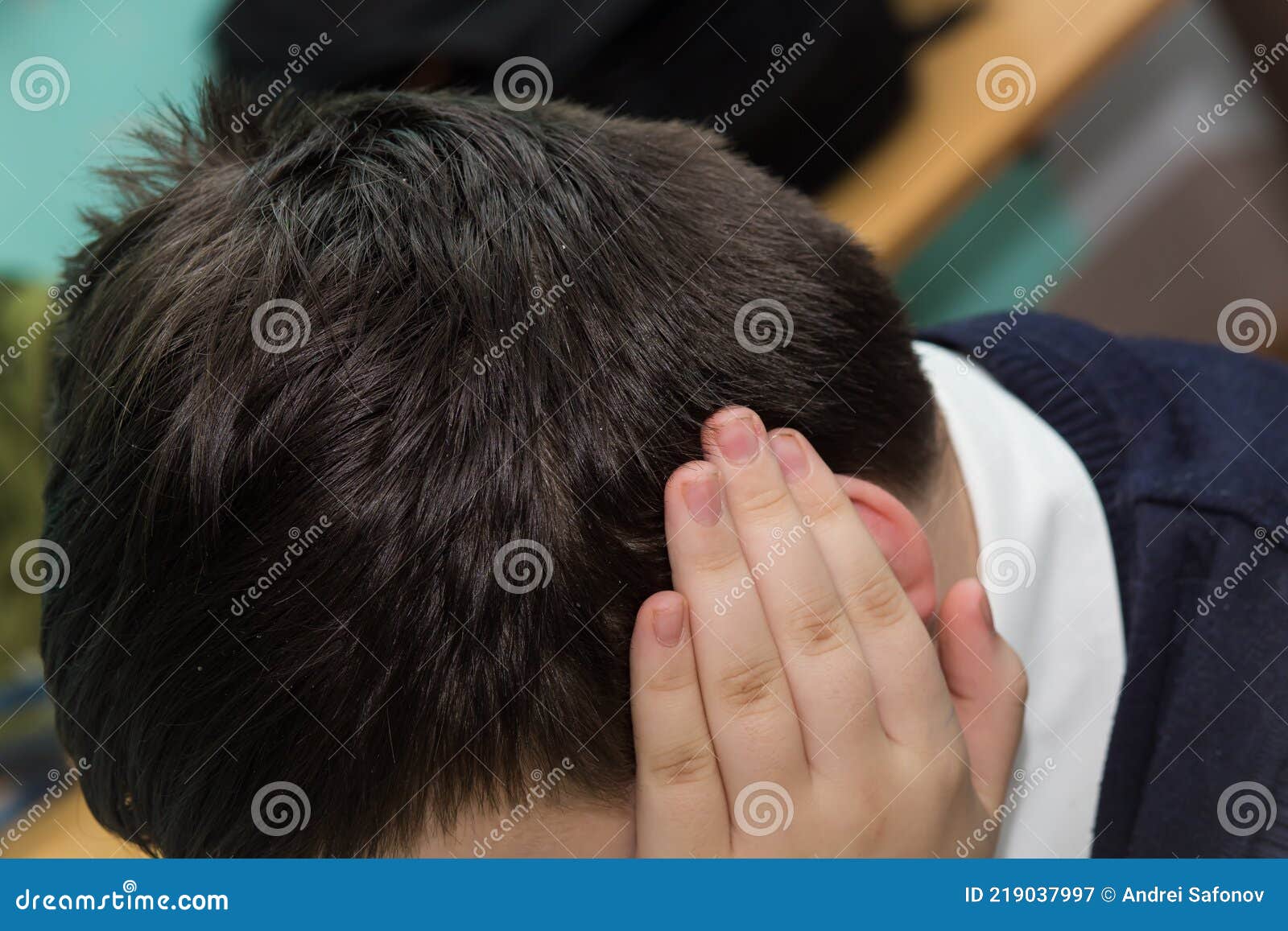 Close-up of a Boy& X27;s Hand Supporting His Head at the Temple. Stock ...
