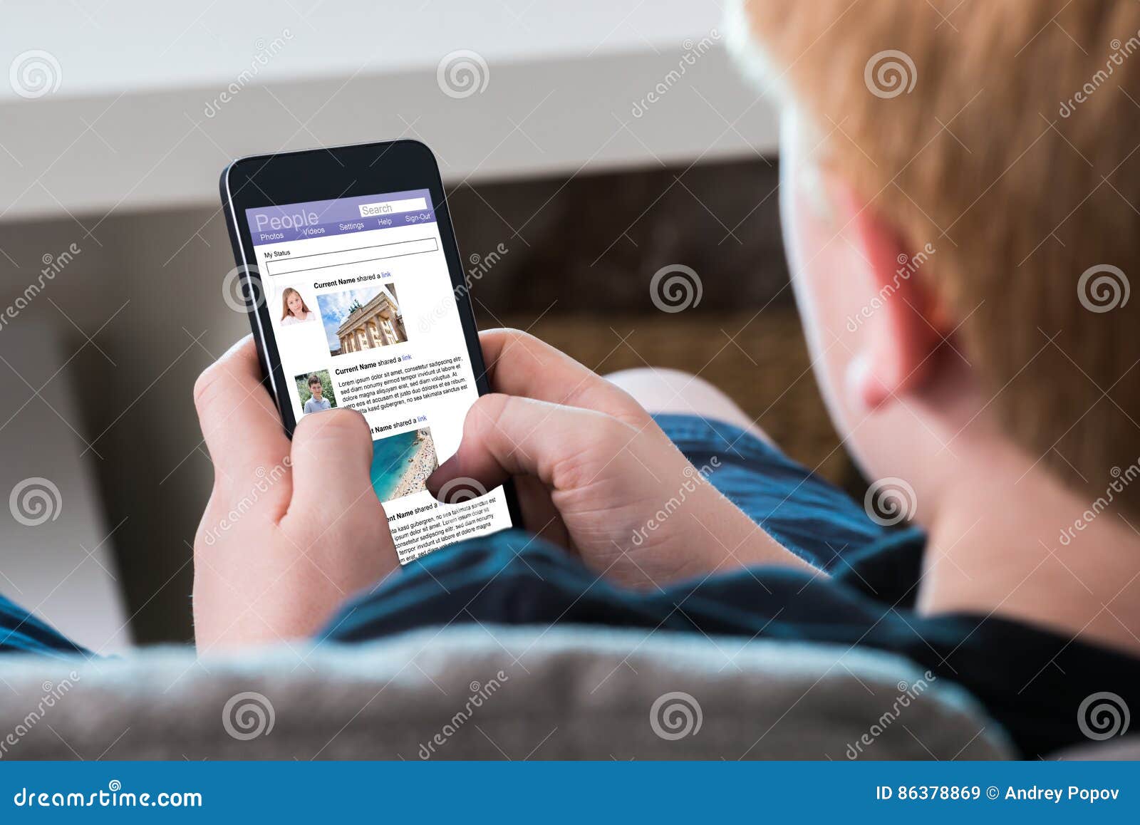 Boy Using Social Networking Site on Mobile Phone Stock Image - Image of ...