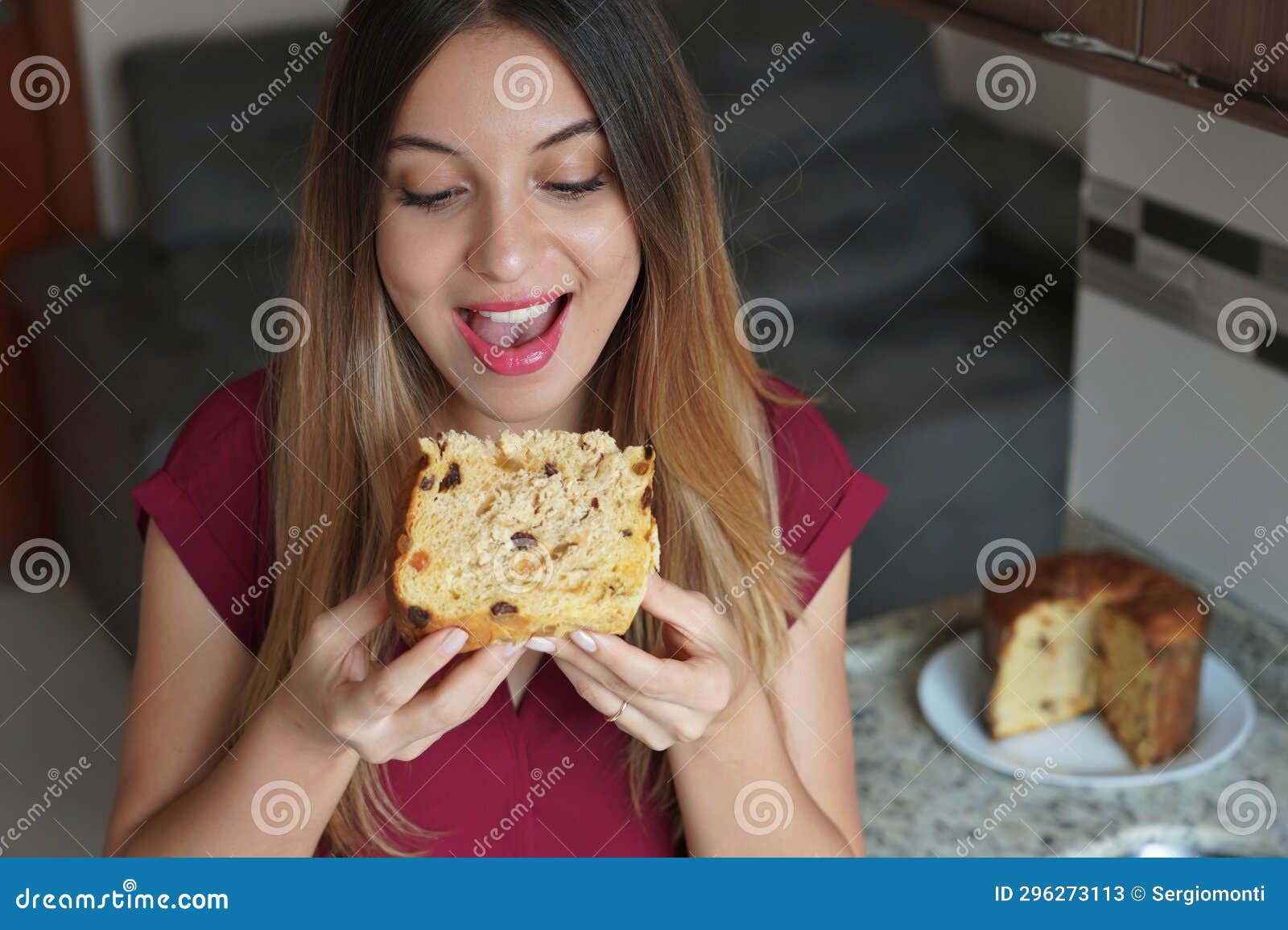 Close Up Of Brazilian Girl Eating A Slice Of Panettone Traditional Christamas Cake With Raisins 1050