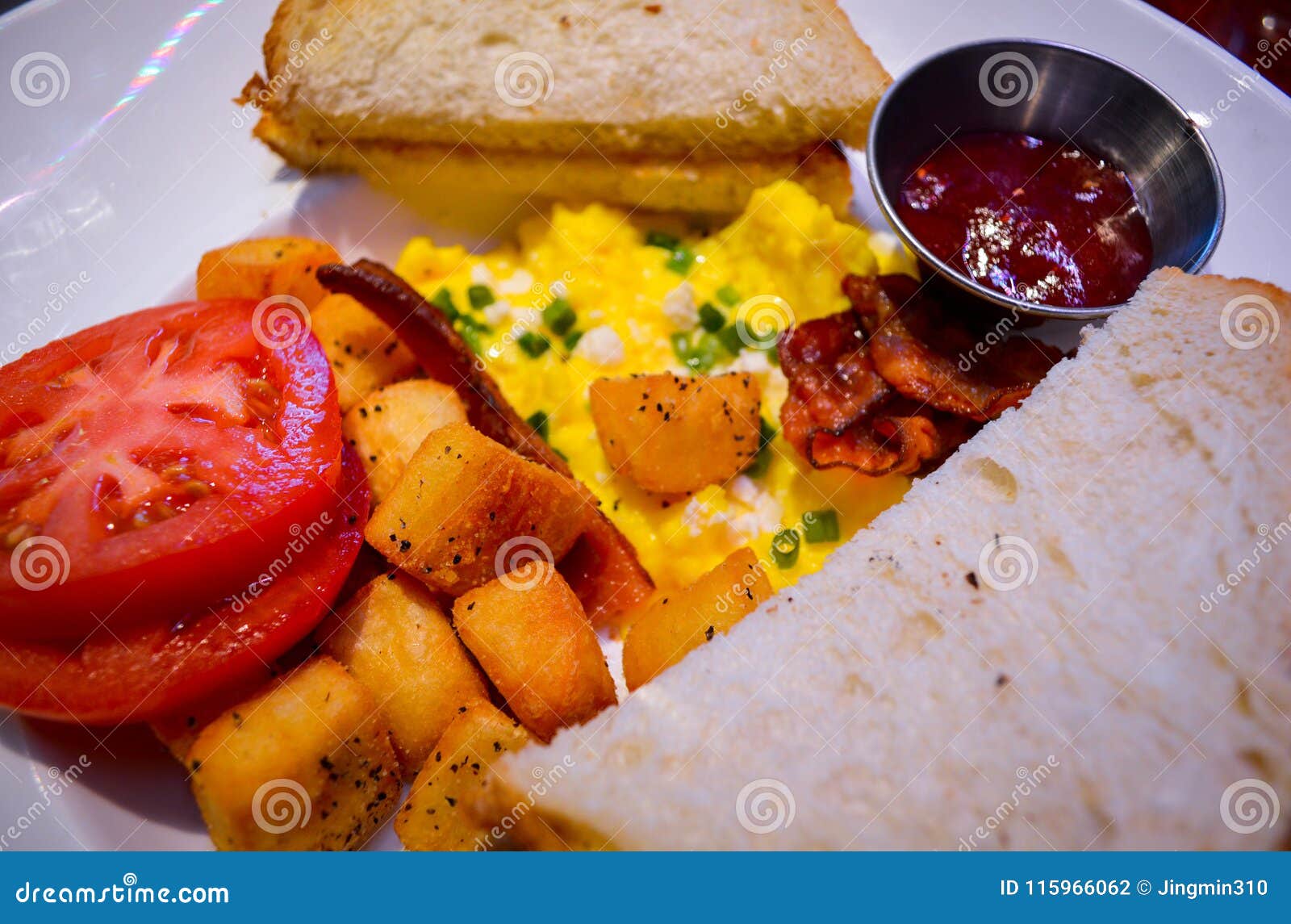 Close Up of Breakfast with Toasted Bread, Scrambled Eggs, and Tomato ...