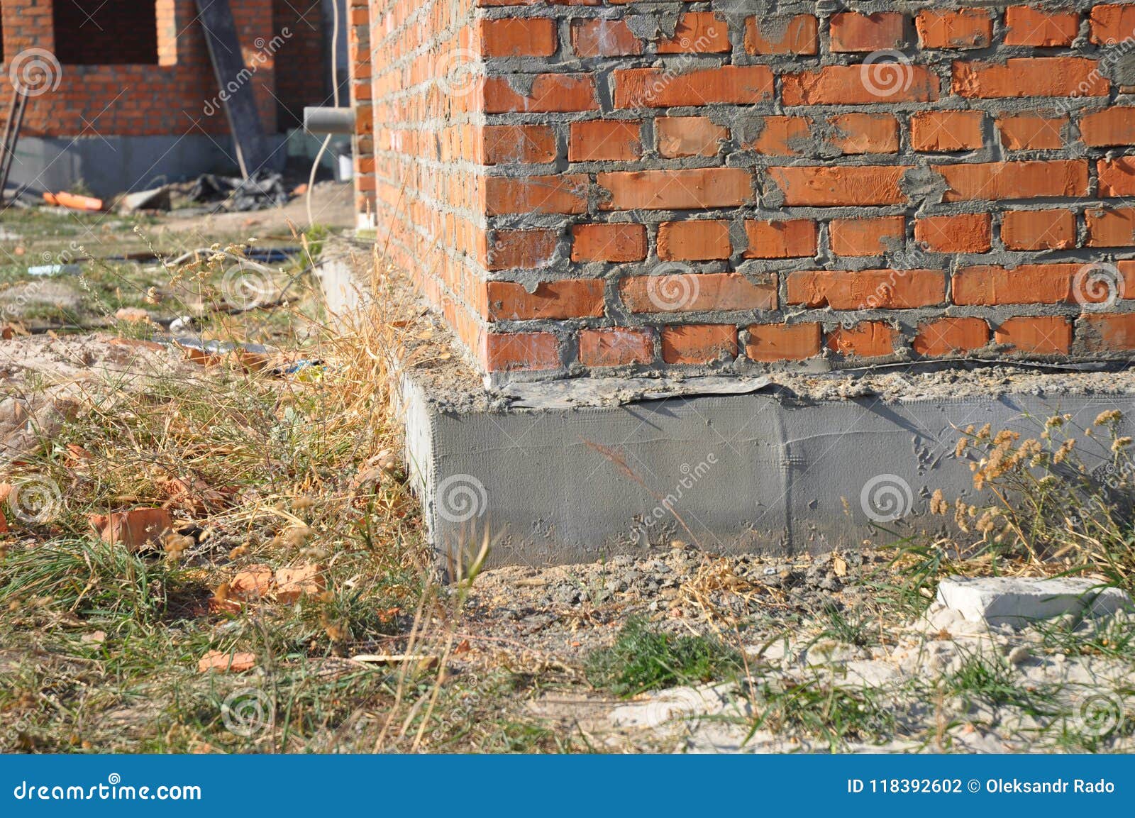 Close Up on Brick House Foundation Insulation with Plastering. Stock ...
