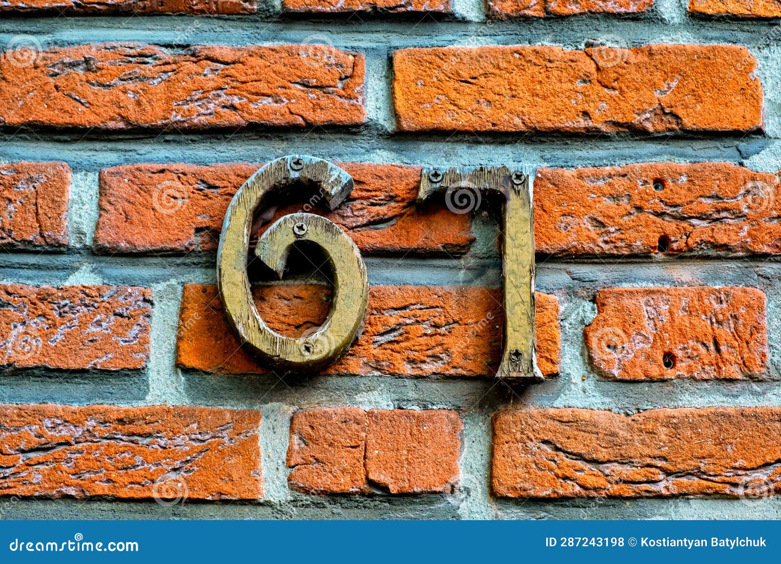 Close-up of the Brick Wall with the Number 67 on it Stock Photo - Image ...