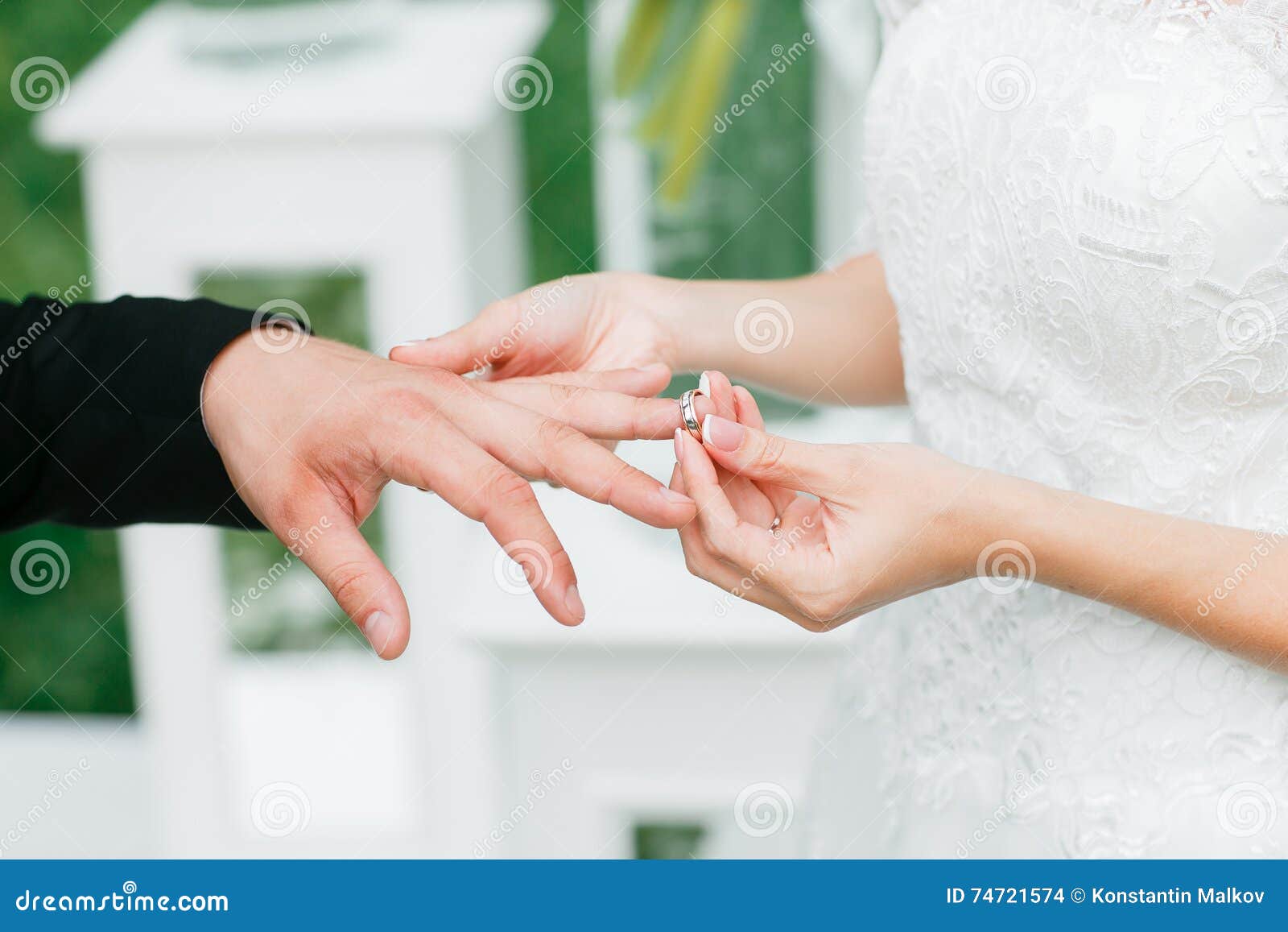Close-up of a Bride Putting Wedding Ring on Groom Stock Photo - Image ...