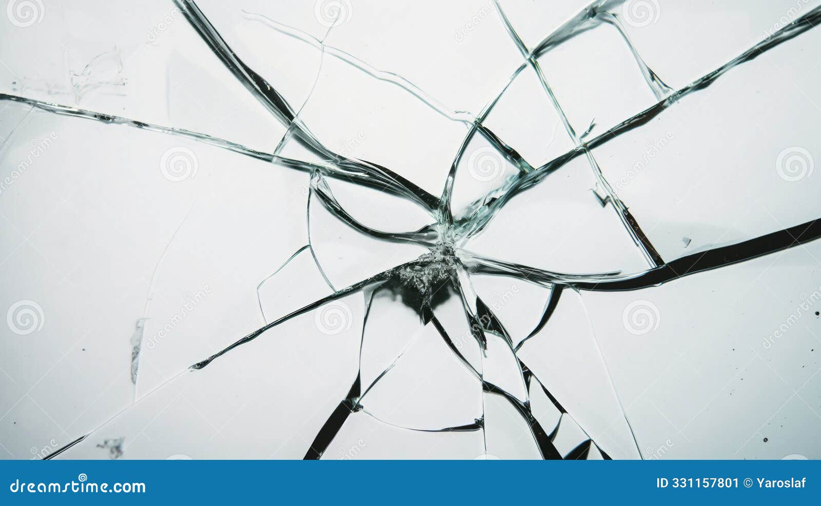 Close-up of Broken Glass with Radiating Cracks on a White Surface. the ...
