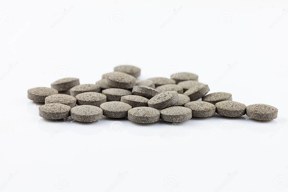 Brown Tablets on White Surface Stock Image - Image of pharmaceutical ...