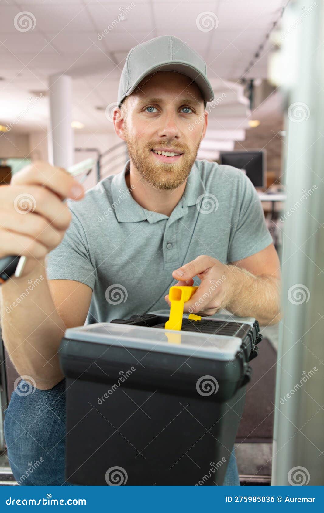 Close Up Builder Carrying Toolbox at Construction Site Stock Photo ...