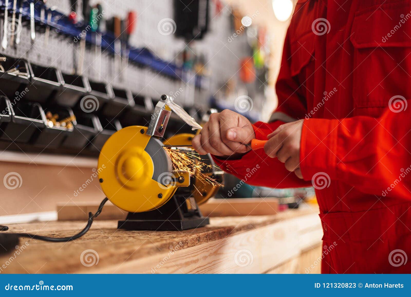 Close Up Builder Using Knife Sharpener in Workshop Isolated Stock Image ...