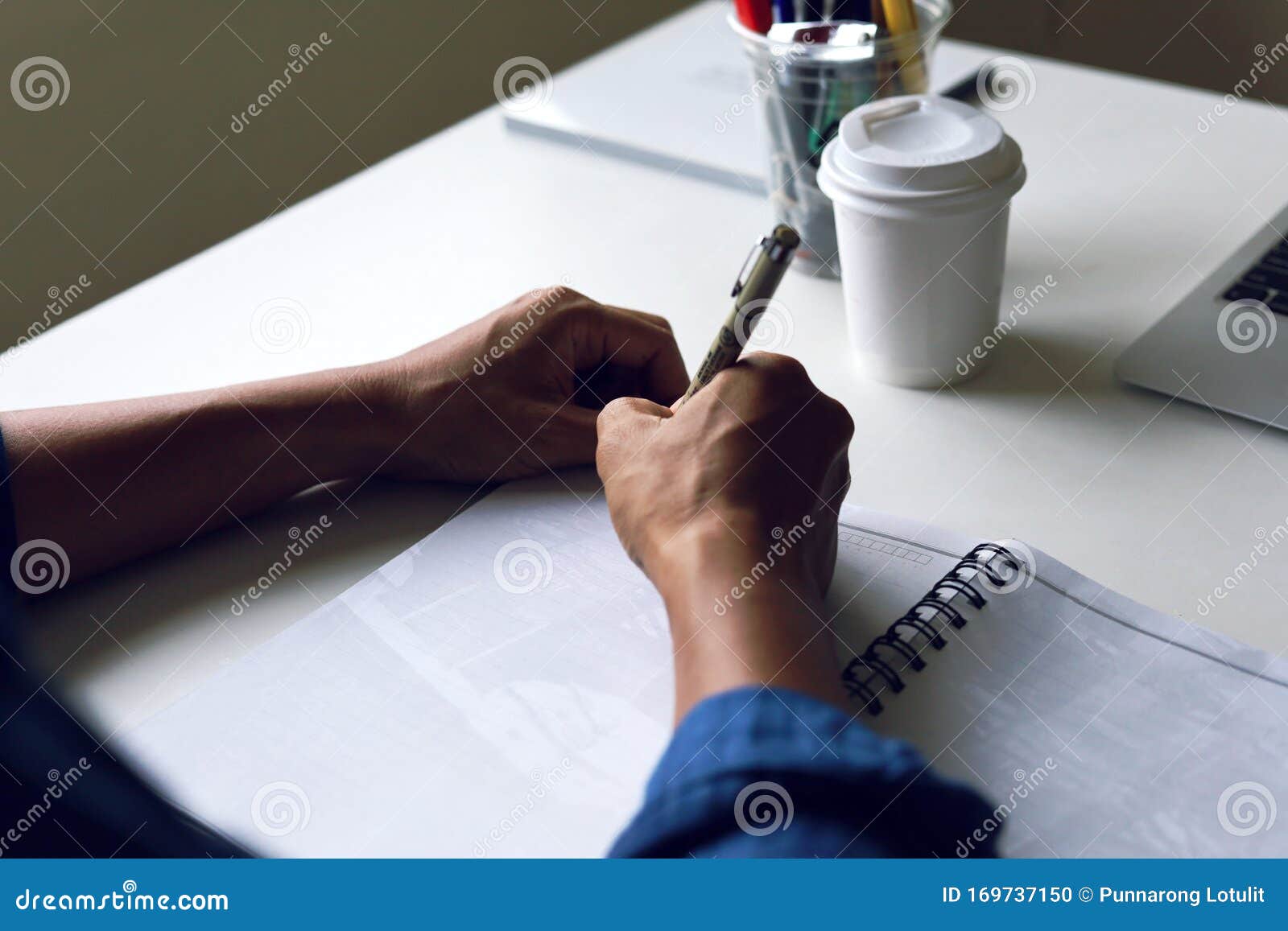 Young Business Man Drawing and Writing Creative Work on Table in the ...
