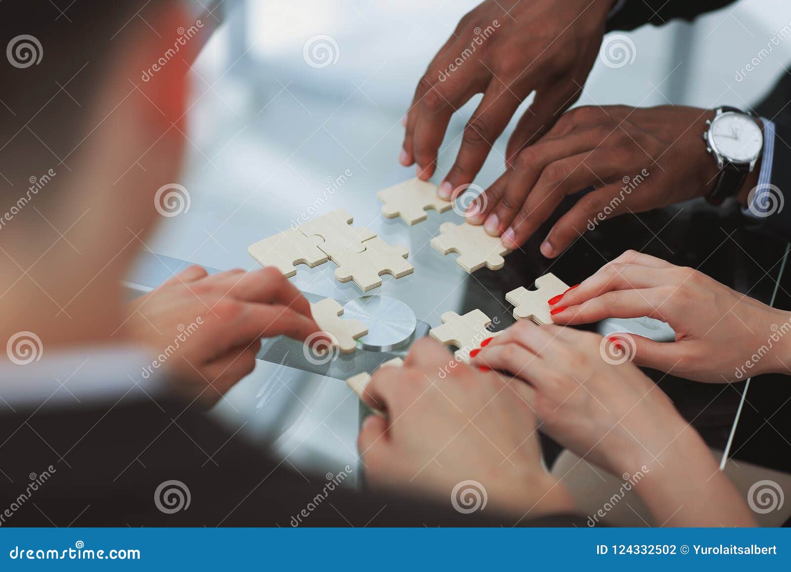 Close Up. Business Team Assembling Puzzle Pieces. Stock Photo - Image ... Close Up. Business Team Assembling Puzzle Pieces. Stock Photo - Image ...