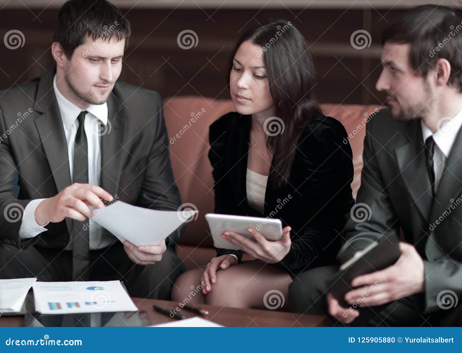 Close Up.business Team Discussing Financial Schedules. the Concept of ... Close Up.business Team Discussing Financial Schedules. the Concept of ...