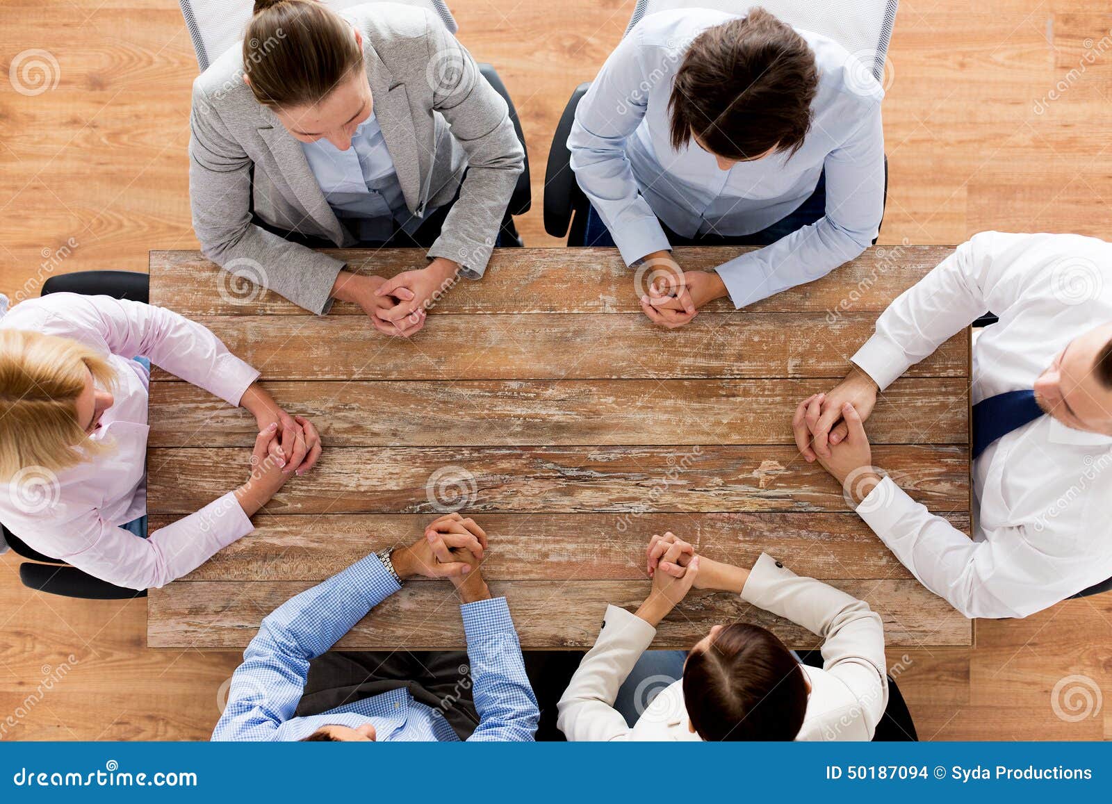 Close Up of Business Team Sitting at Table Stock Photo - Image of ...
