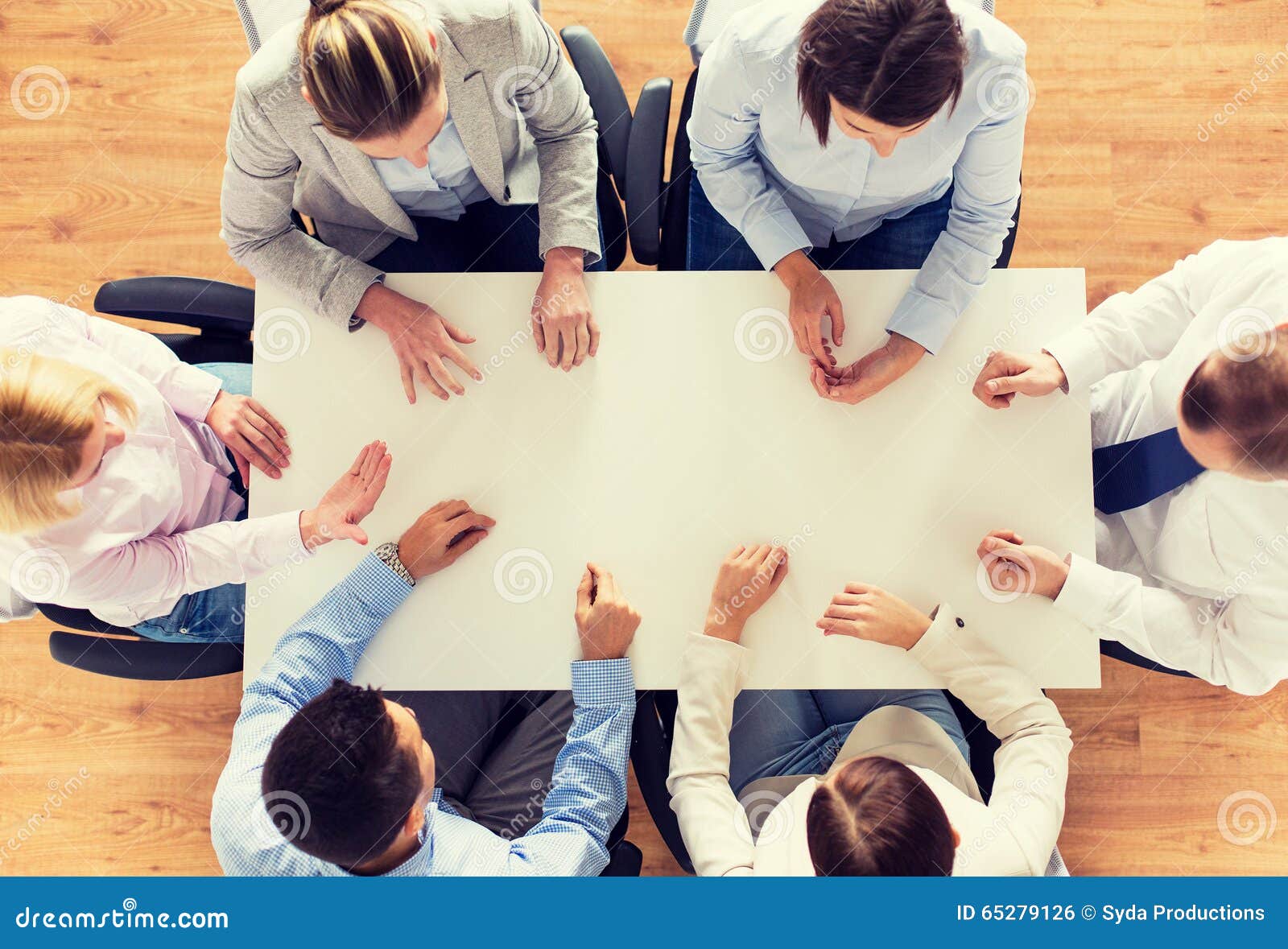 Close Up of Business Team Sitting at Table Stock Photo - Image of ...