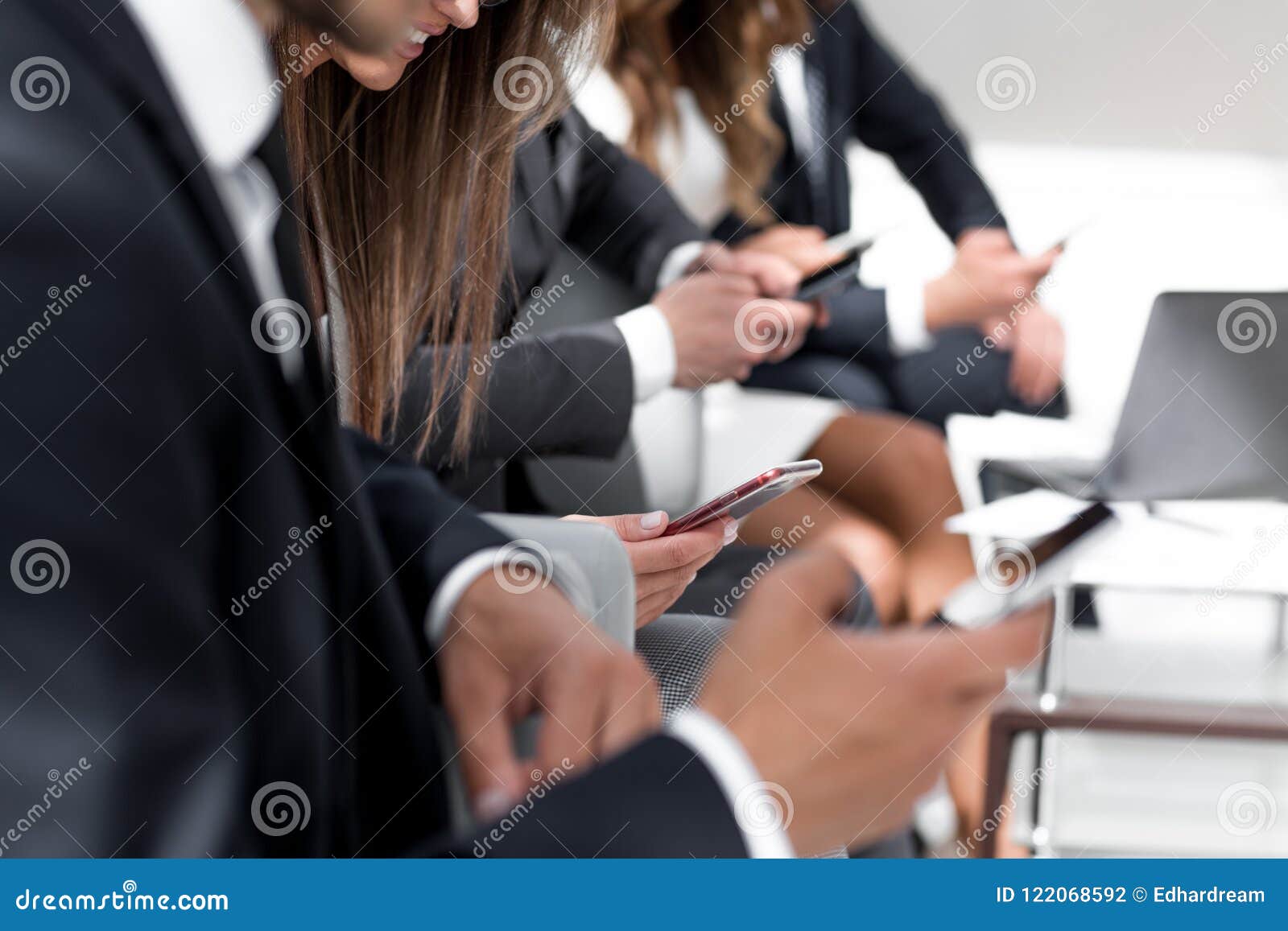 Close Up.business Team Using Their Smartphones in the Workplace Stock ...