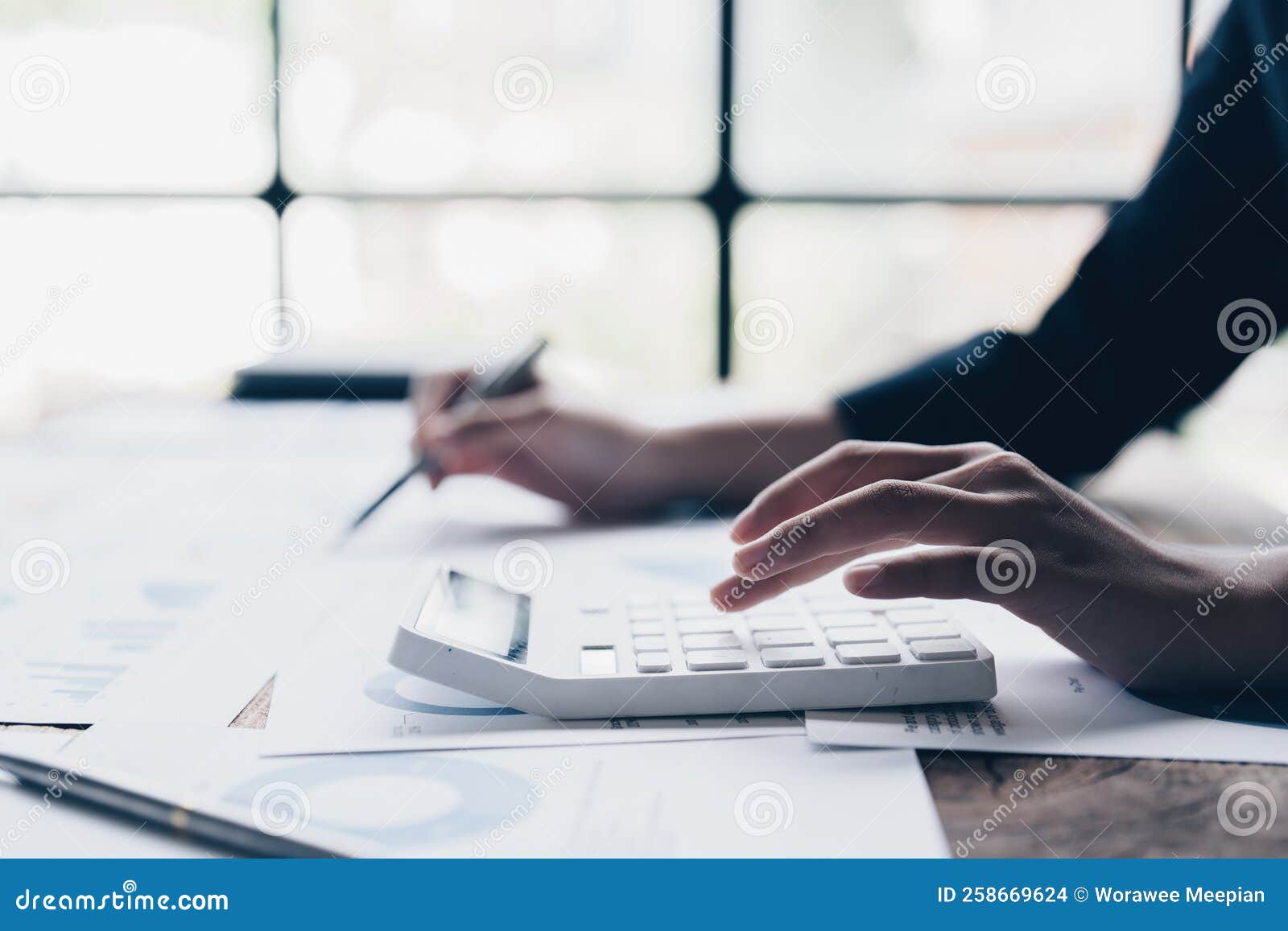 Close Up Business Woman Hand Using Calculator To Calculate the Company ... Close Up Business Woman Hand Using Calculator To Calculate the Company ...