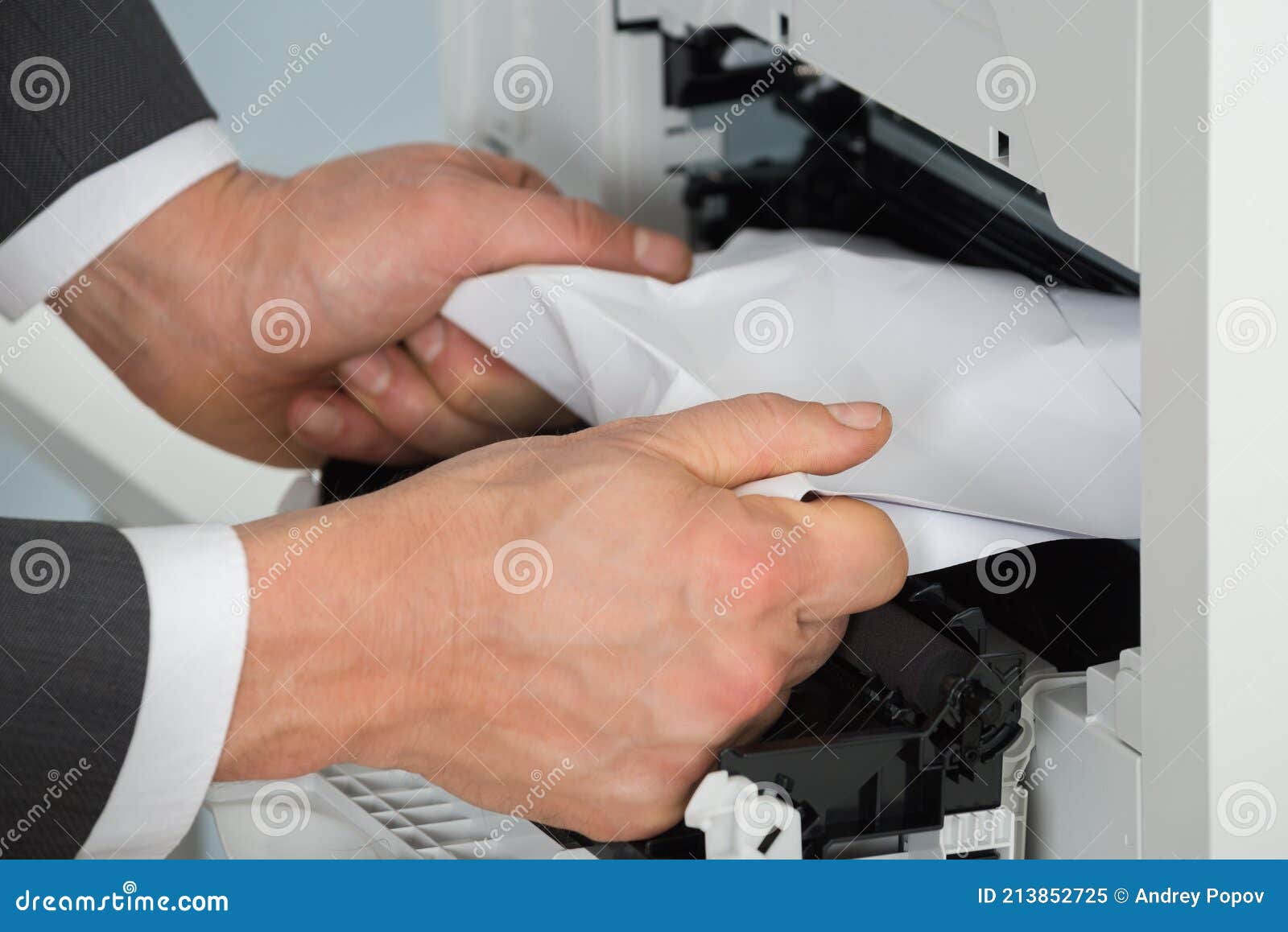 Businessman Removing Paper Stuck in Printer at Office Stock Image ... Businessman Removing Paper Stuck in Printer at Office Stock Image ...