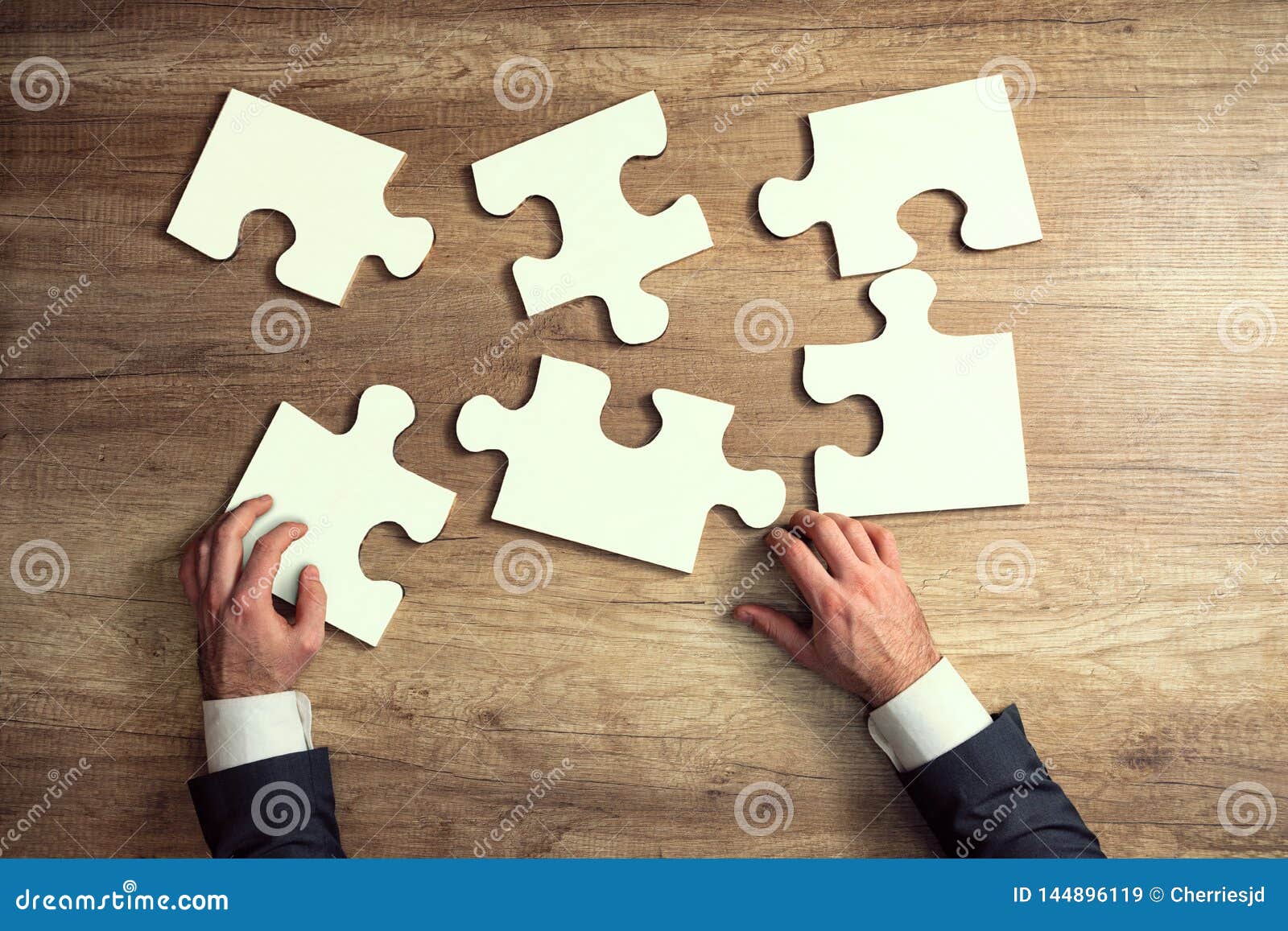 Close-up of Businessman Hands Try To Completing Jigsaw Puzzle Stock ...