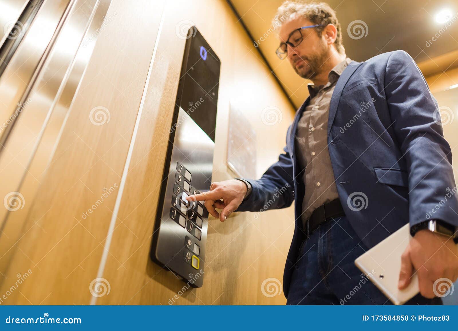 Man Pressing Modern Elevator Button with His Forefinger Stock Photo ...