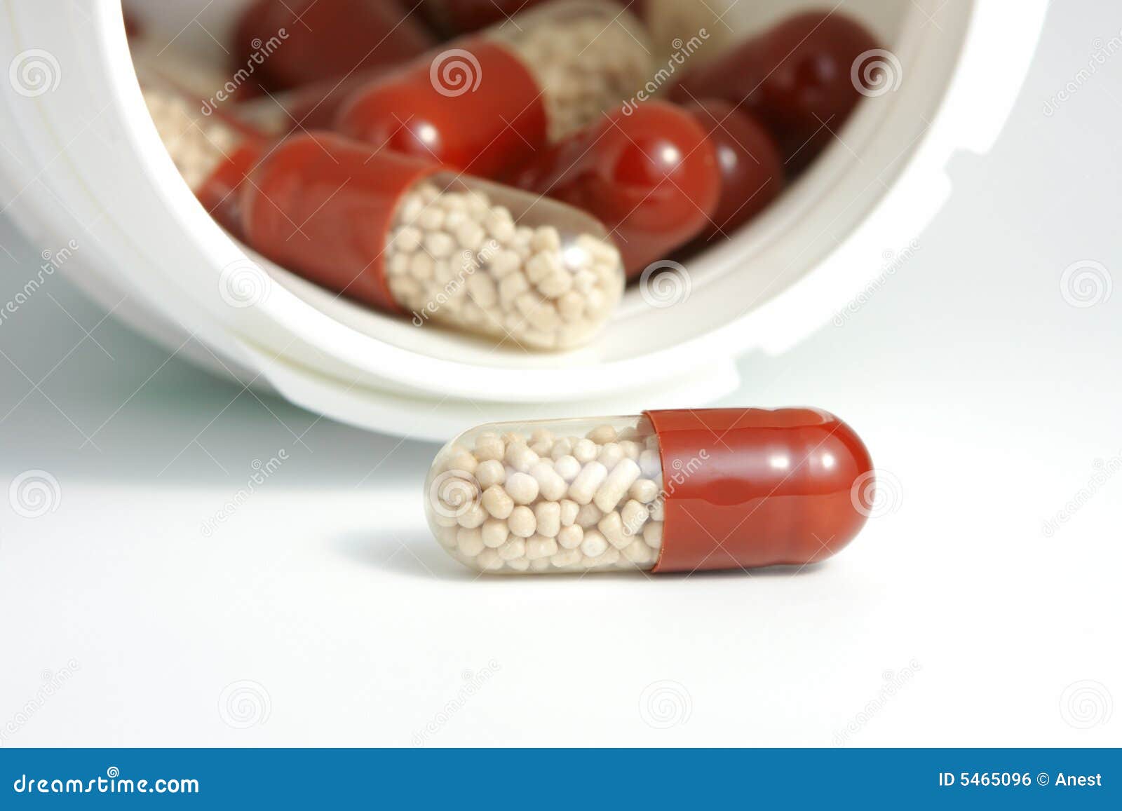 Close-up of Capsule with Open Bottle on Background Stock Photo - Image ...