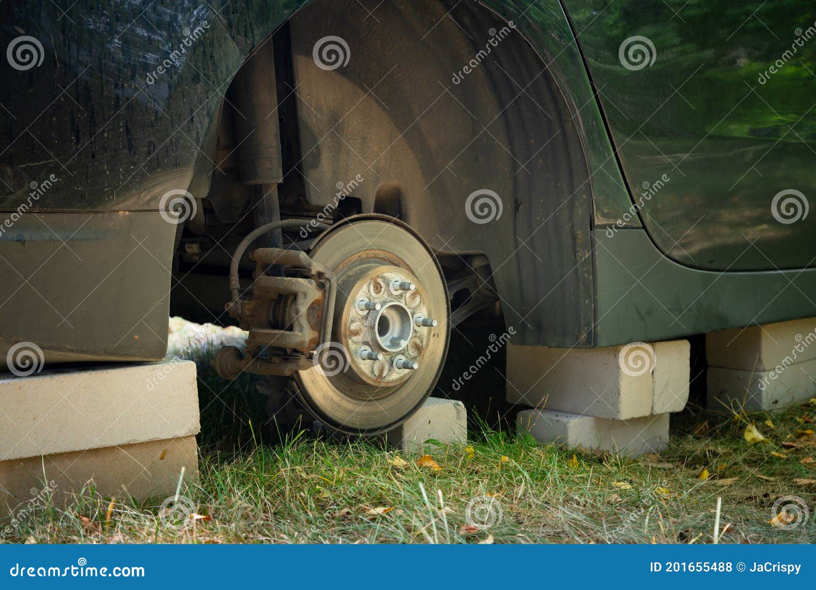 Close Up of Car on Bricks Outside. Concept of Stolen Vehicle Wheels ...