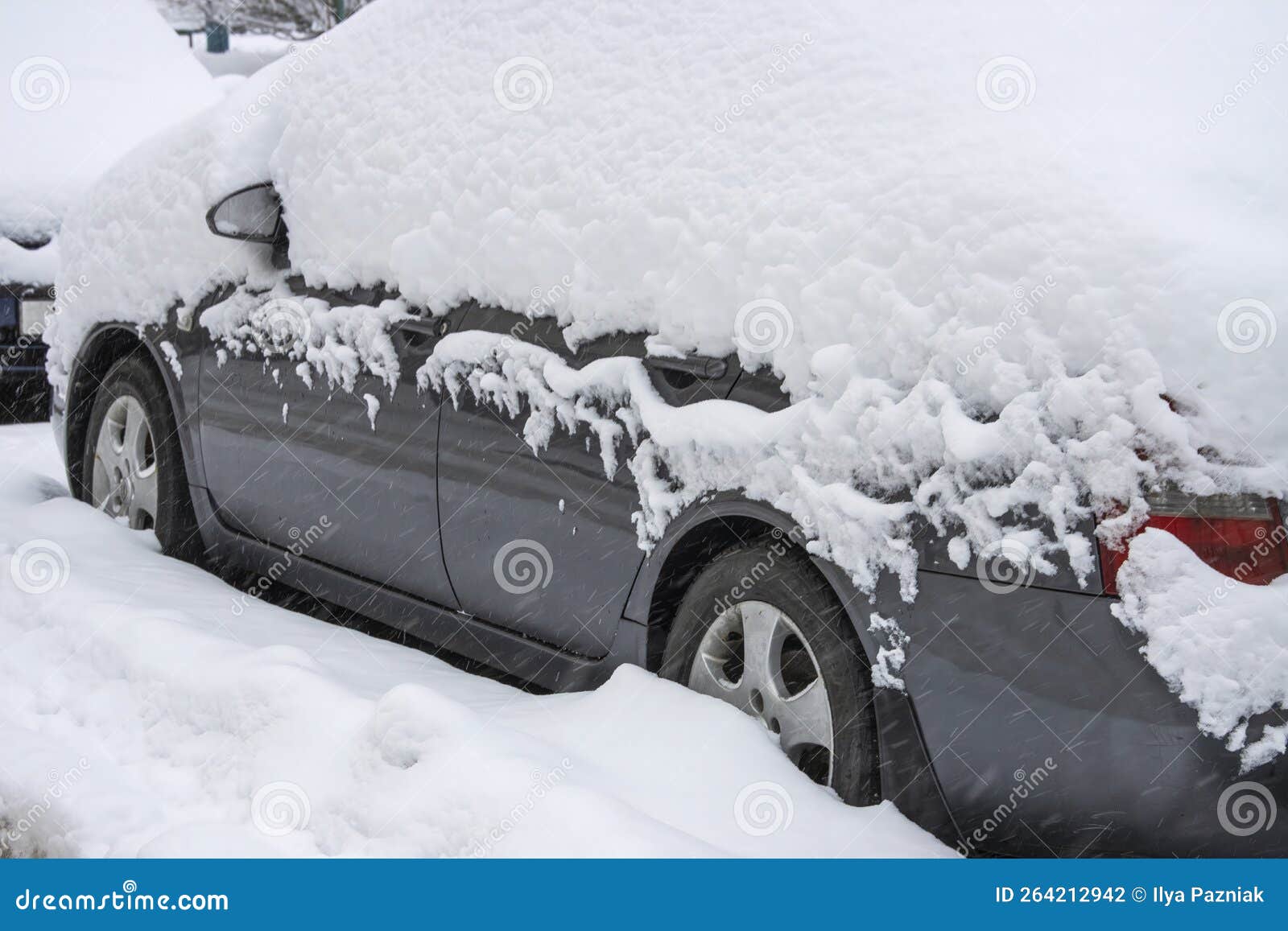 Close-up of a Car Covered in a Thick Layer of Snow during a Snowstorm ...