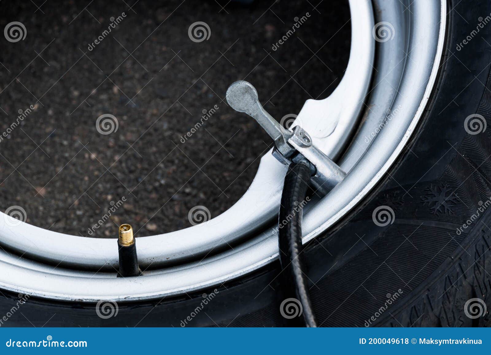 Close-up Car Wheel and Pump Tip Stock Photo - Image of wheel ...