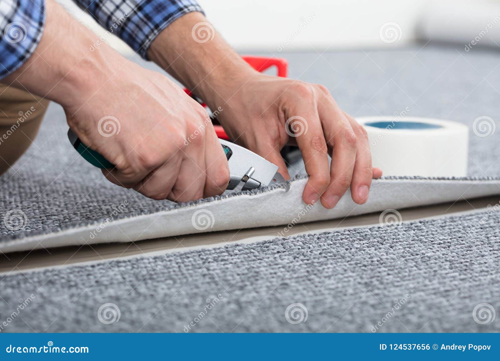 Carpenter Laying Carpet stock photo. Image of hand, fluffy - 124537656