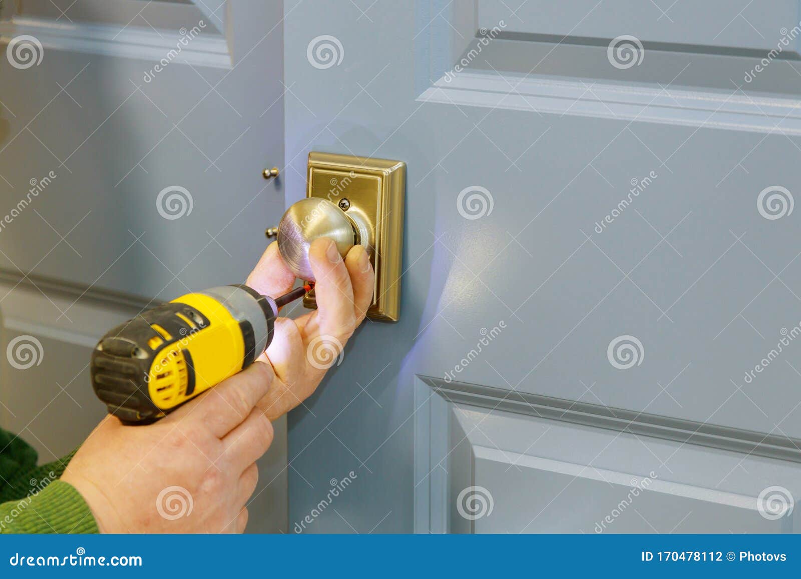 Close-up Carpenter Hands with Doorlock during Lock Process Installation ...