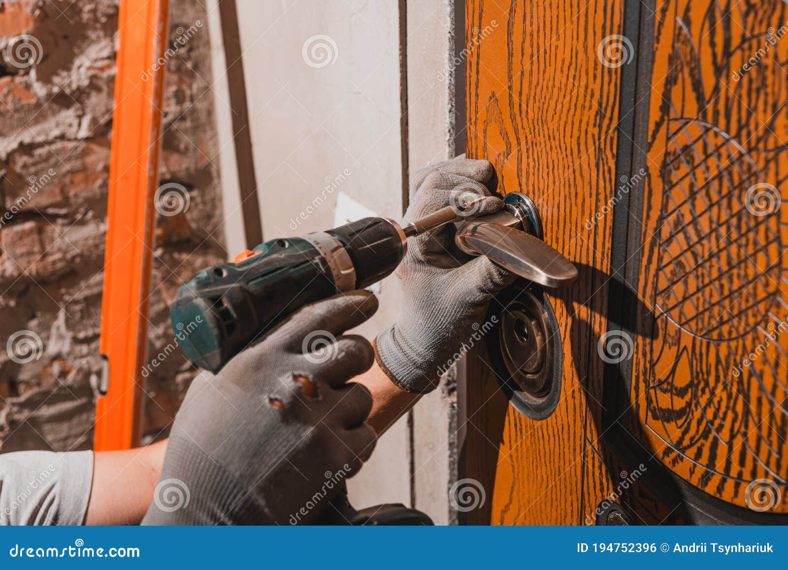 Close-up, The Carpenter Installs A Custom Lock In The Front Metal Door ...