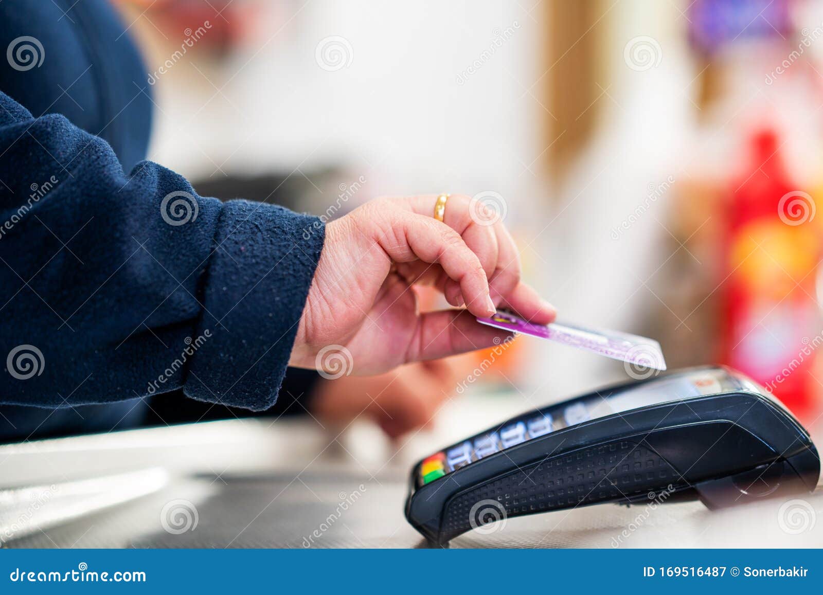 Close Up of Cashier is Using Contactless Credit Card Pos Terminal To ... Close Up of Cashier is Using Contactless Credit Card Pos Terminal To ...