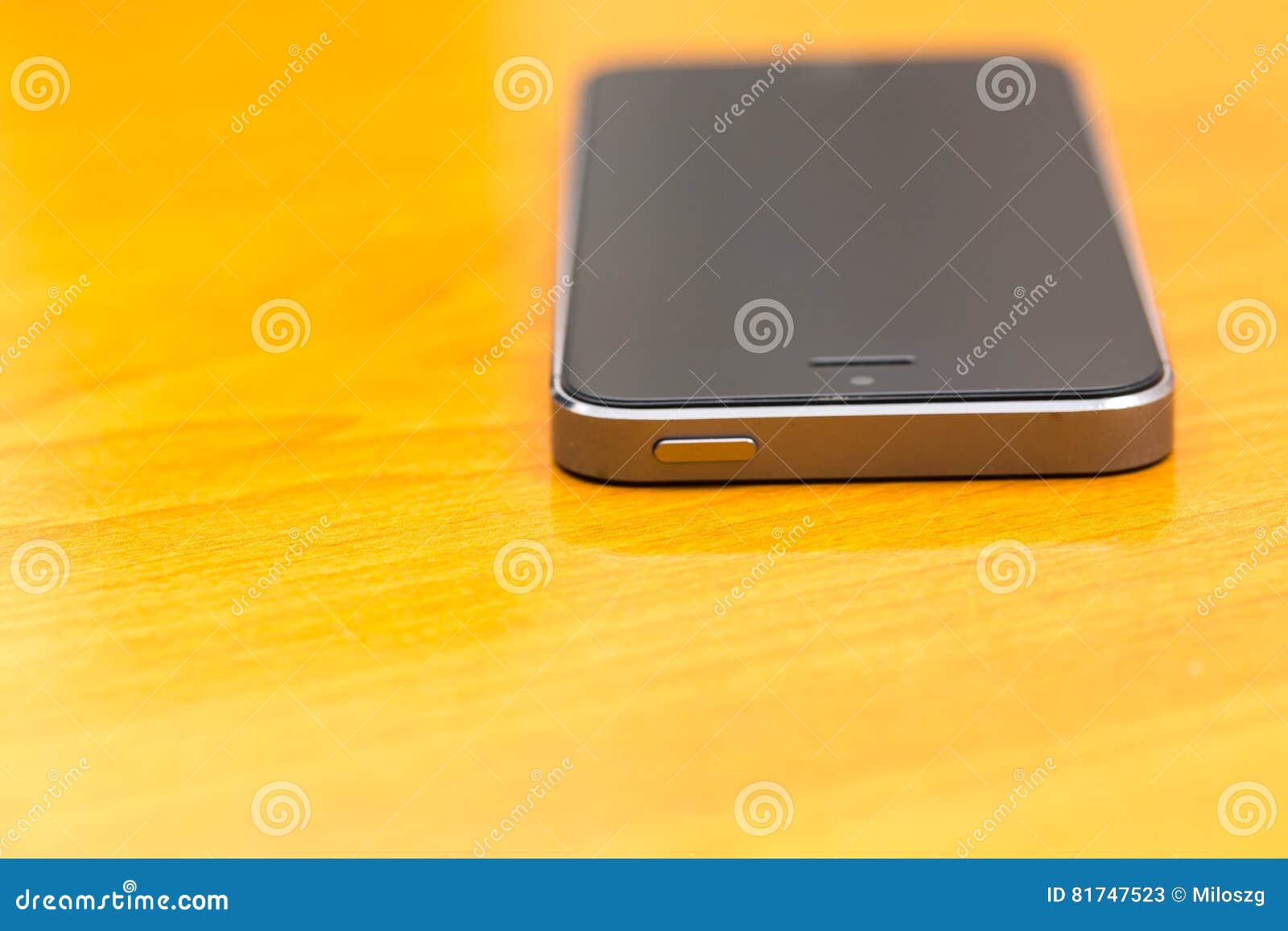 Close Up of Cellphone Lying on Wooden Table Stock Image - Image of ...
