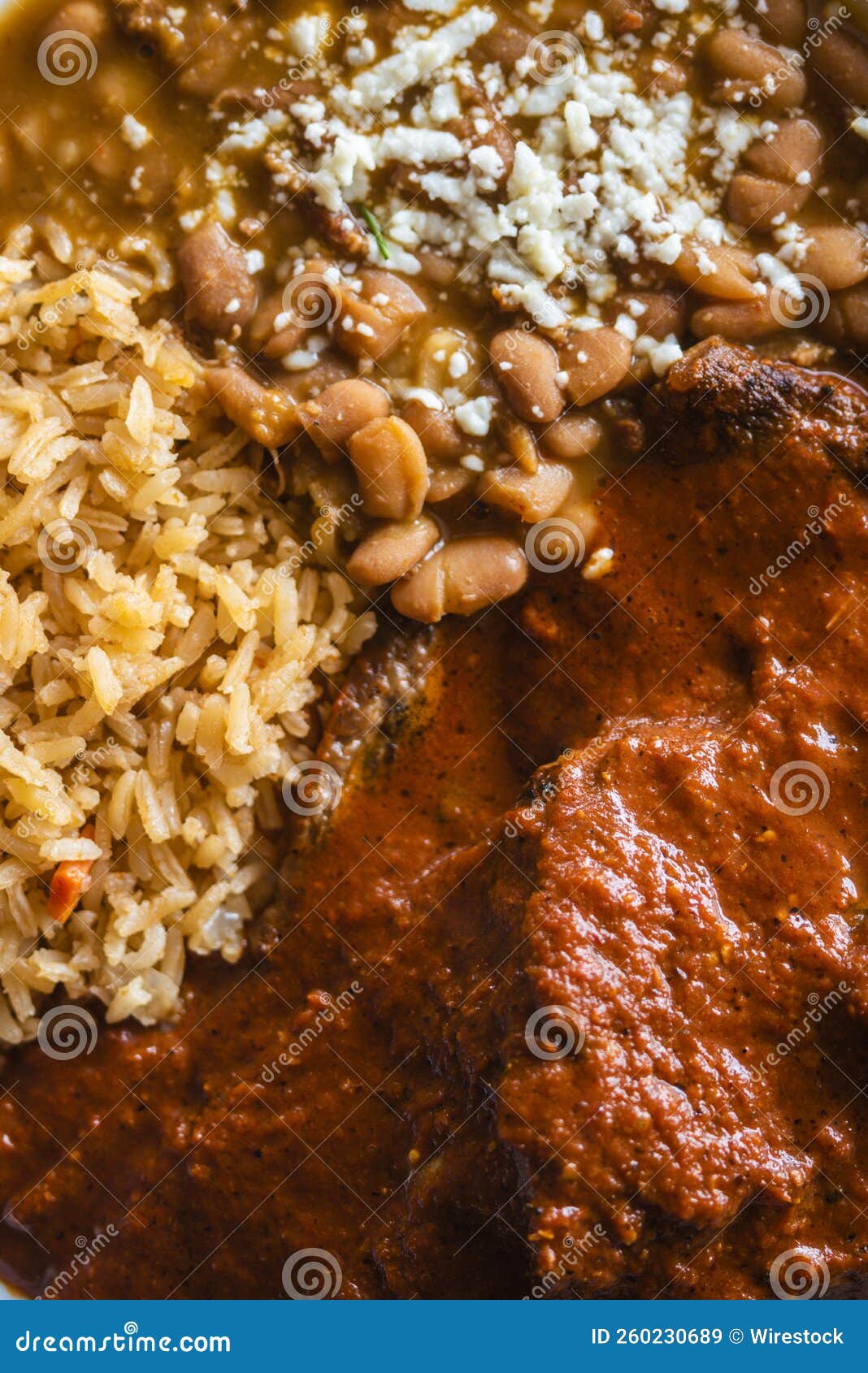 Close Up of Charro Beans and Rice with a Side of Mole Stock Image ...