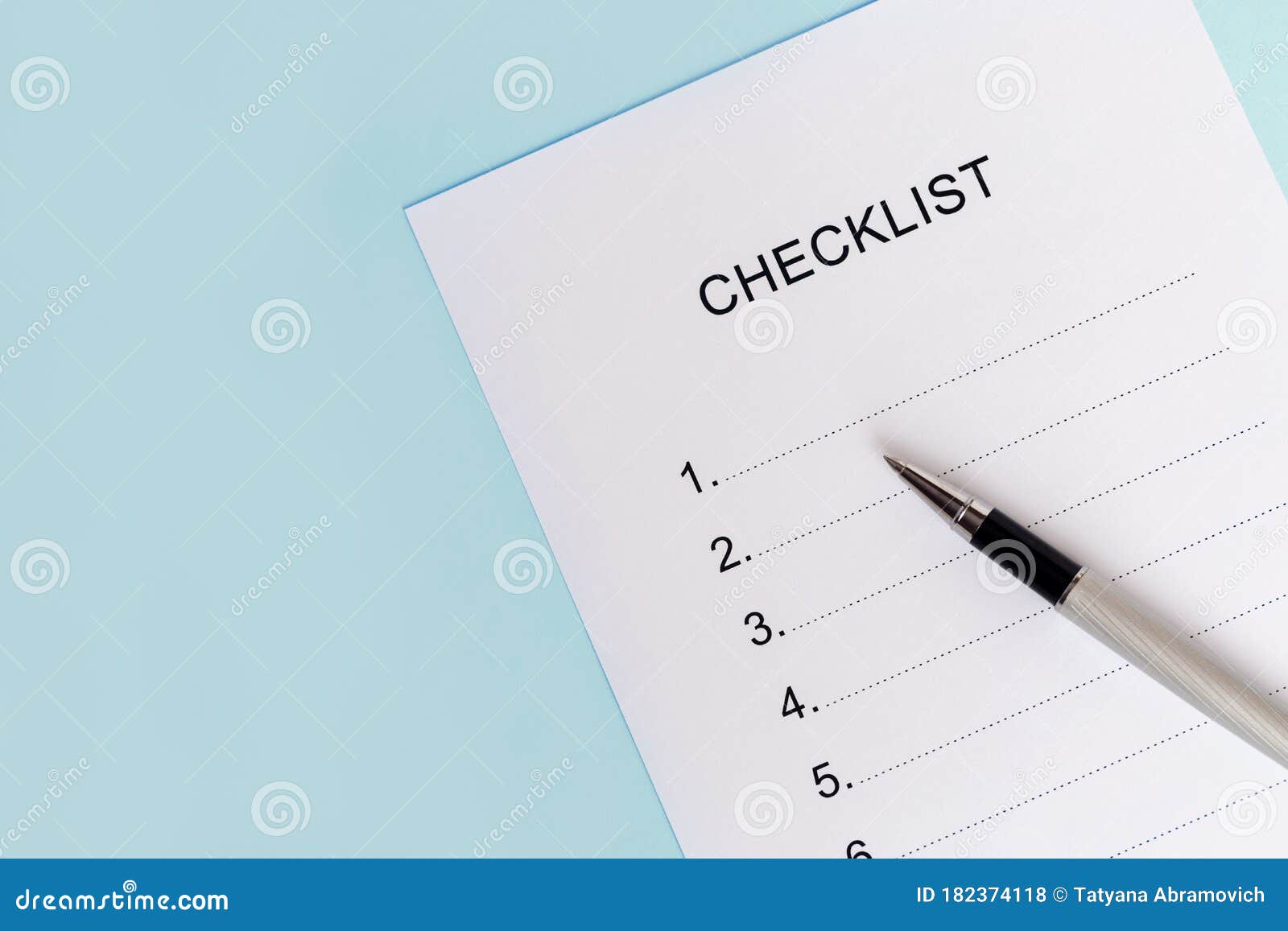 Close-up of on Checklist with Pen on a Blue Background Stock Photo ...