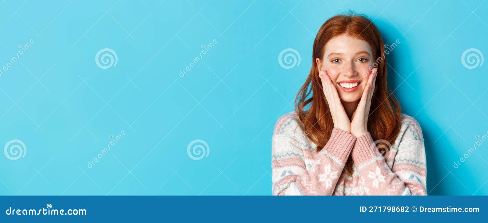 Close Up Of Cheerful Redhead Girl Blushing Touching Cheeks And Smiling