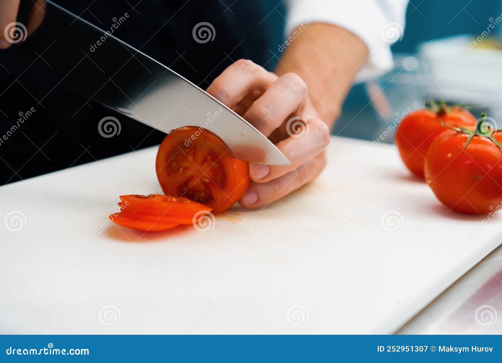 Close-up of a Chef Slicing Tomato in a Professional Restaurant Kitchen ...