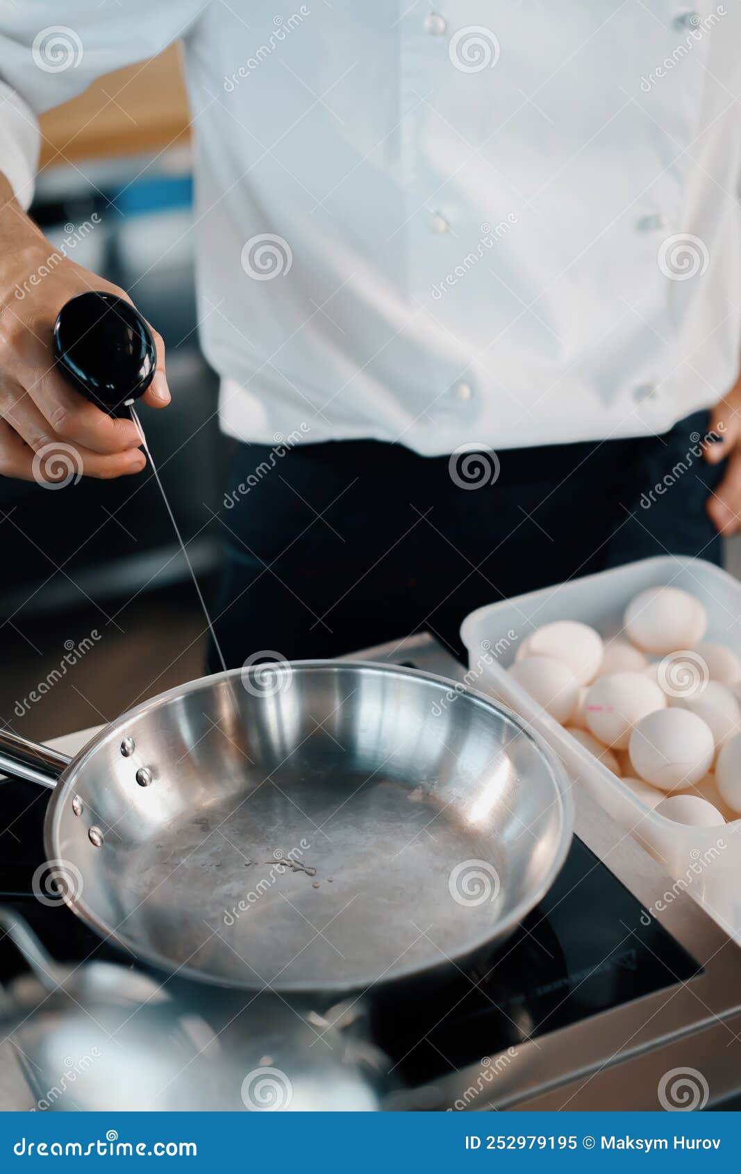 Close-up of the Chef Splashing Oil into a Frying Pan. Frying Surface ...