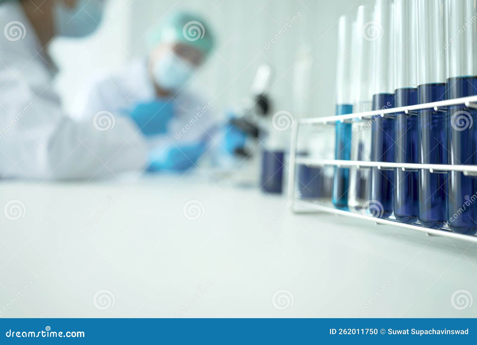 Close Up Chemical Test Tubes with Scientists Stock Photo - Image of ...