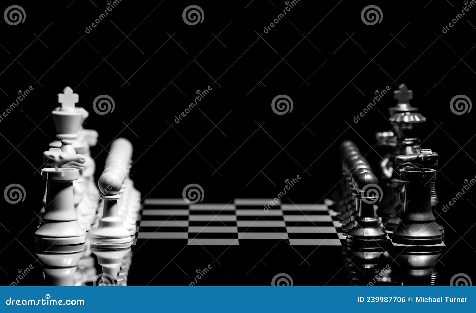 Close Up of Chess Pieces on a Reflective Mirror Board Surface with ...