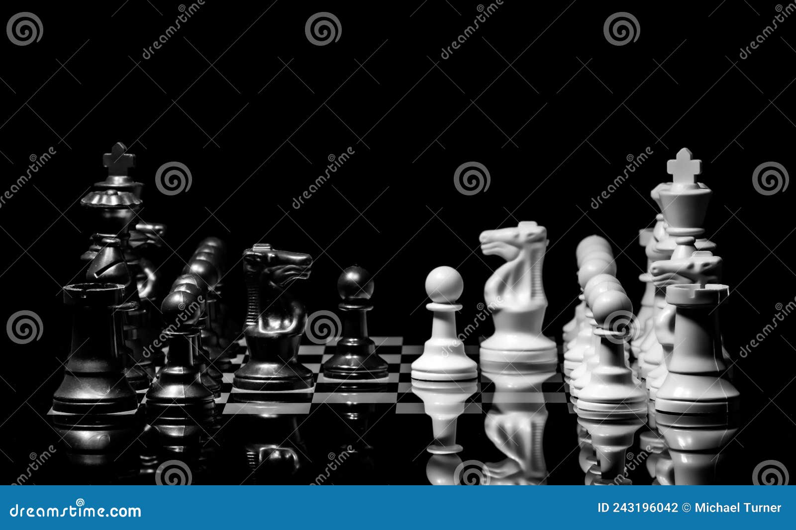 Close Up of Chess Pieces on a Reflective Mirror Board Surface with ...