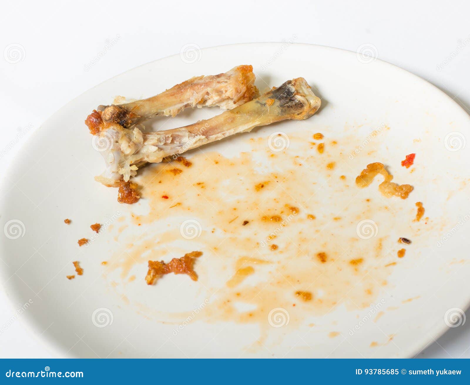 Close Up of Chicken Bone on the White Dish with with Waste Food Stock ...