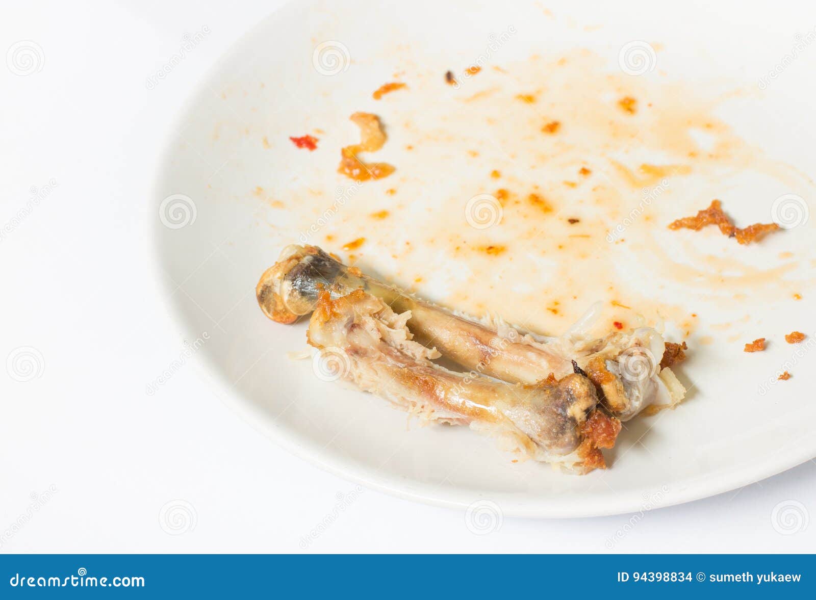 Close Up of Chicken Bone on the White Dish with with Waste Food Stock ...