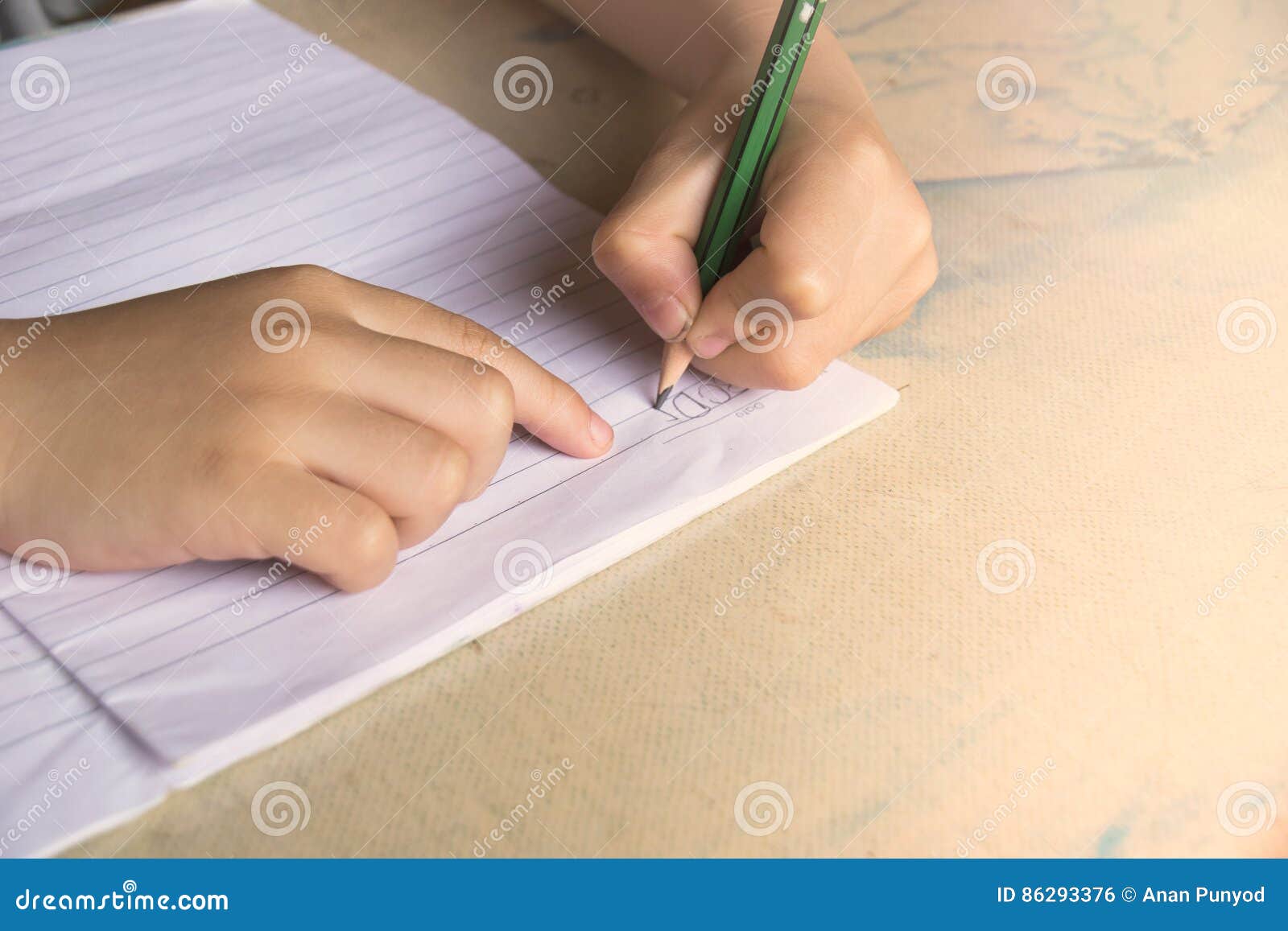 Close Up Children are Holding a Pencil and Writing. Stock Photo - Image ...