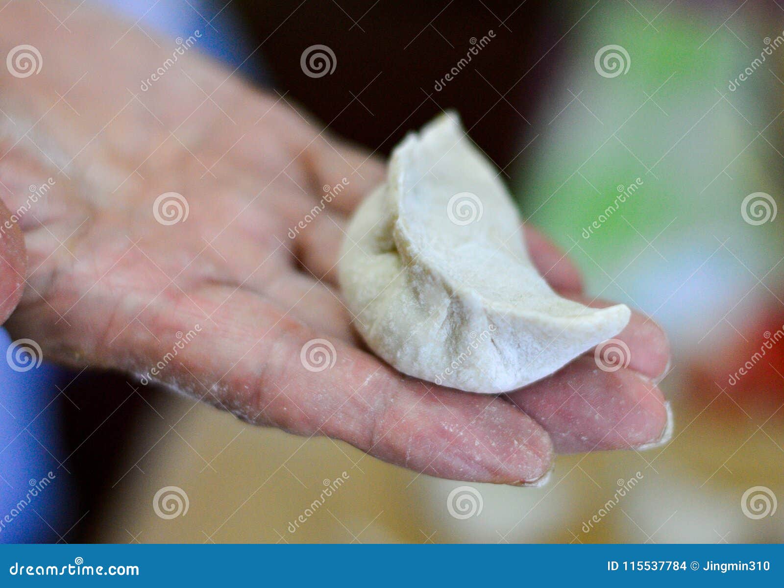 Close-up of Chinese Uncooked Dumpling Placed on a Hand Stock Photo ...